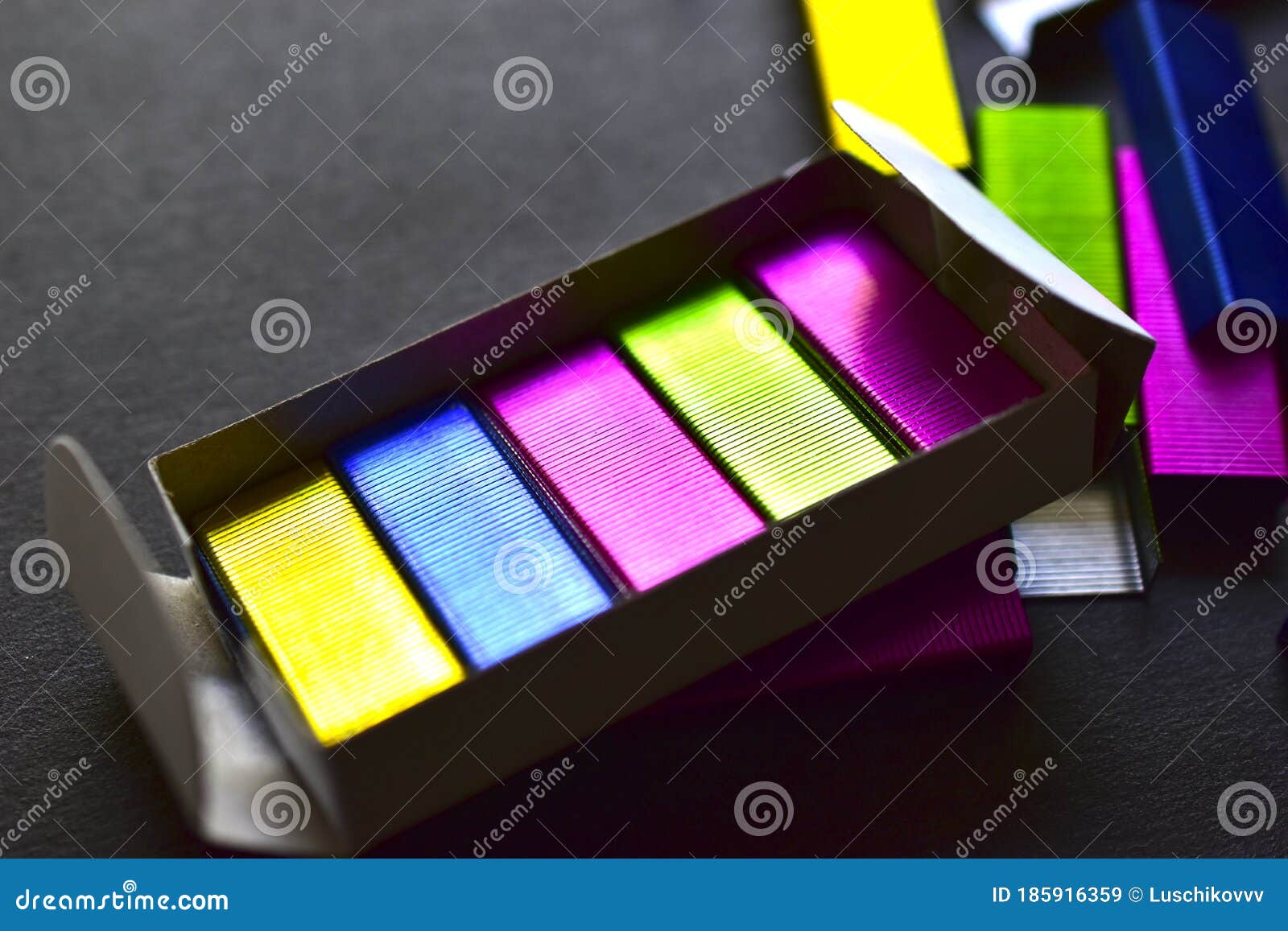 Multi-colored Stapler Staples on a Black Background Stock Image - Image ...