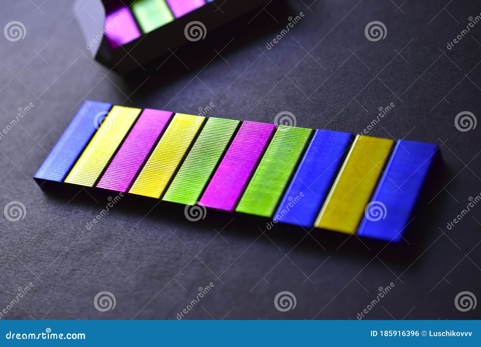 Multi-colored Stapler Staples on a Black Background Stock Photo - Image ...