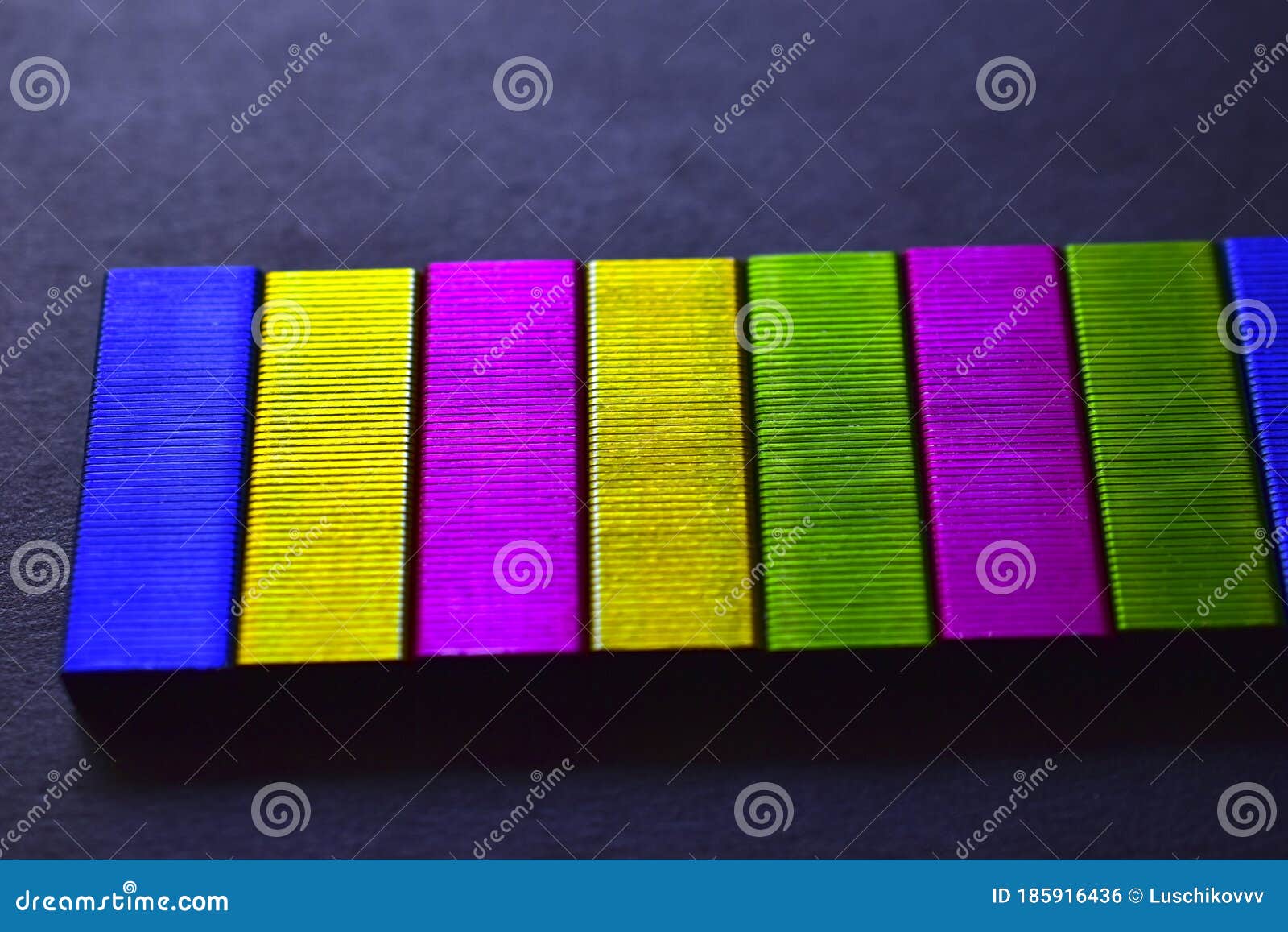 Multi-colored Stapler Staples on a Black Background Stock Photo - Image ...