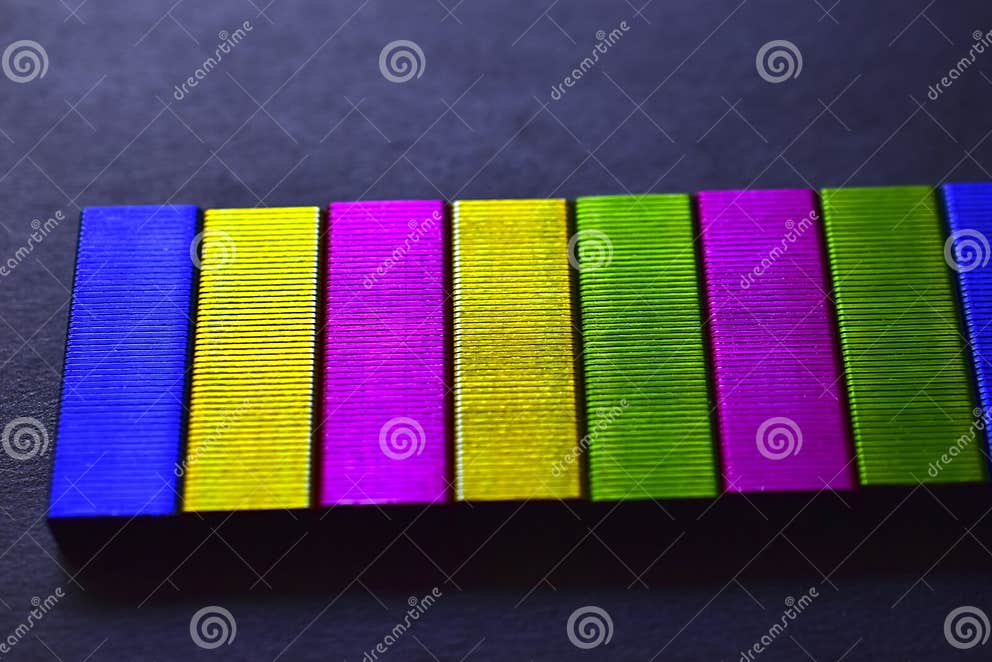 Multi-colored Stapler Staples on a Black Background Stock Photo - Image ...