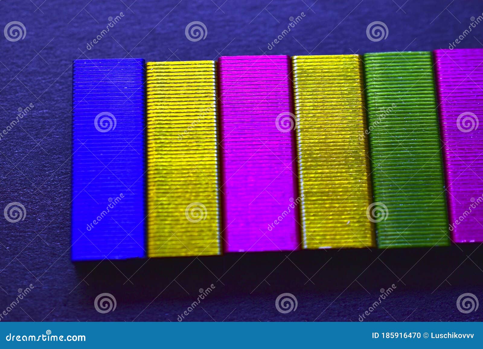Multi-colored Stapler Staples on a Black Background Stock Photo - Image ...