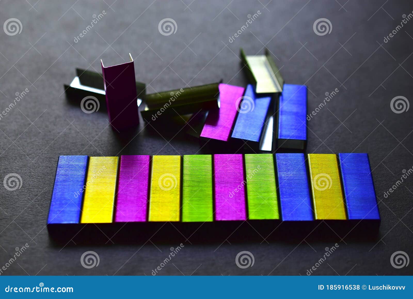 Multi-colored Stapler Staples on a Black Background Stock Photo - Image ...