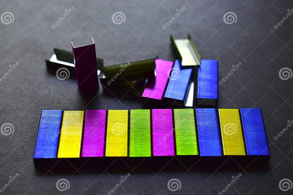 Multi-colored Stapler Staples on a Black Background Stock Photo - Image ...