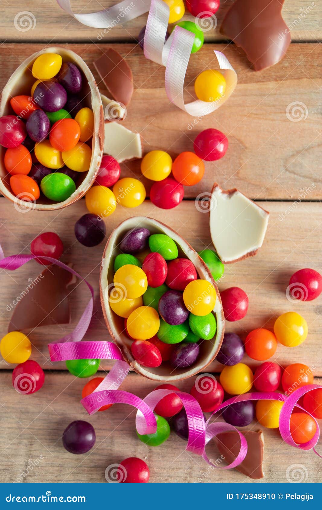 Multi-colored Sweets and Easter Chocolate Eggs on a Light Wooden ...