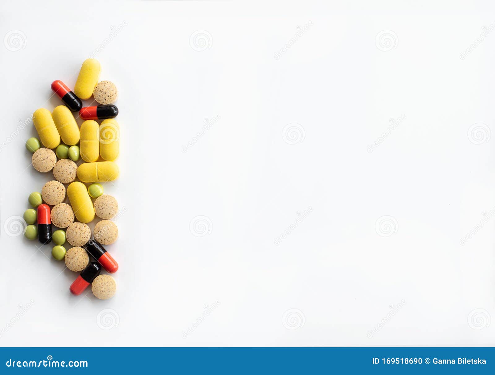 Multi-colored Tablets and Capsules of Various Shapes on the Left Along ...