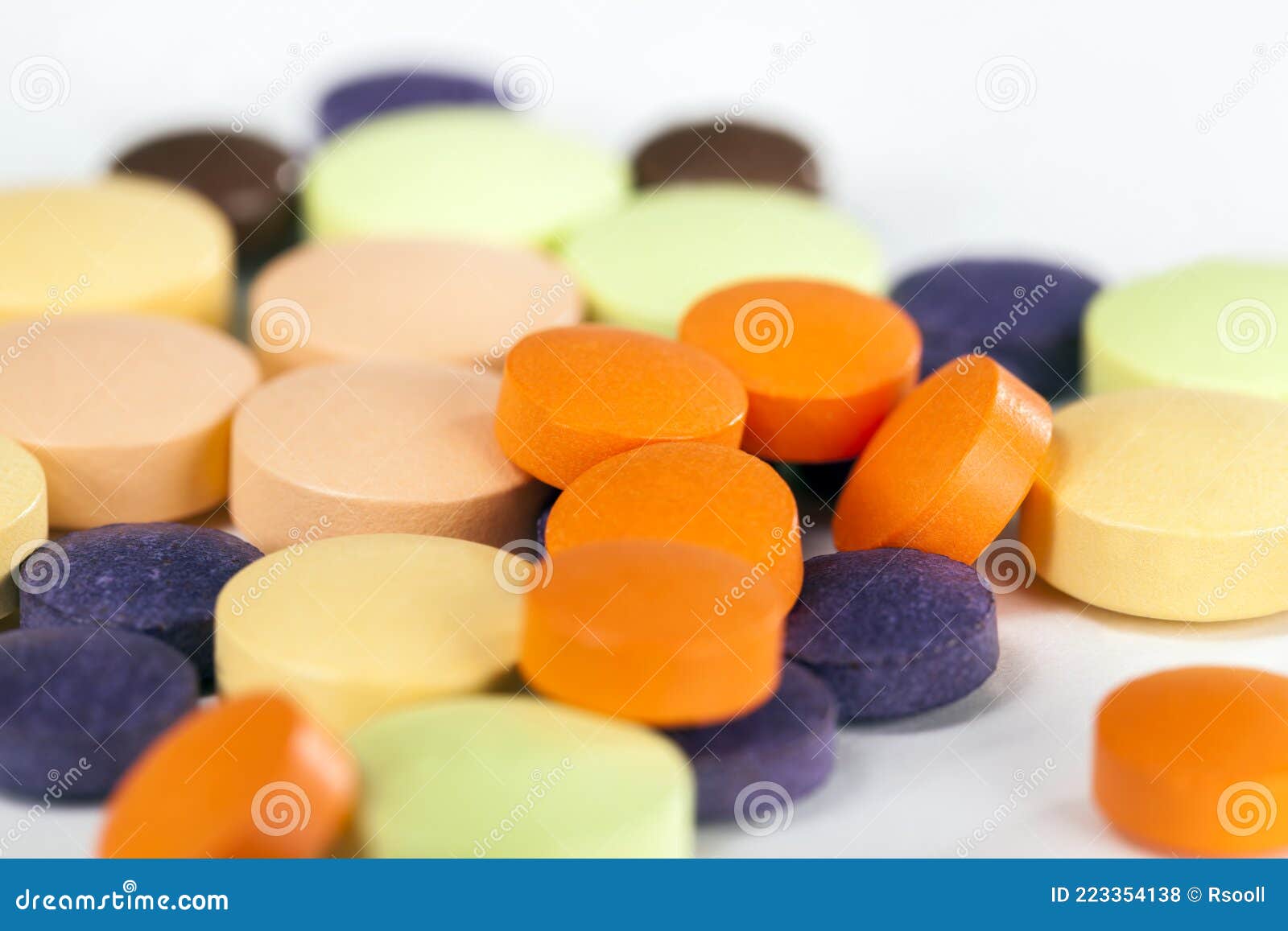Multi-colored tablets stock photo. Image of medication - 223354138