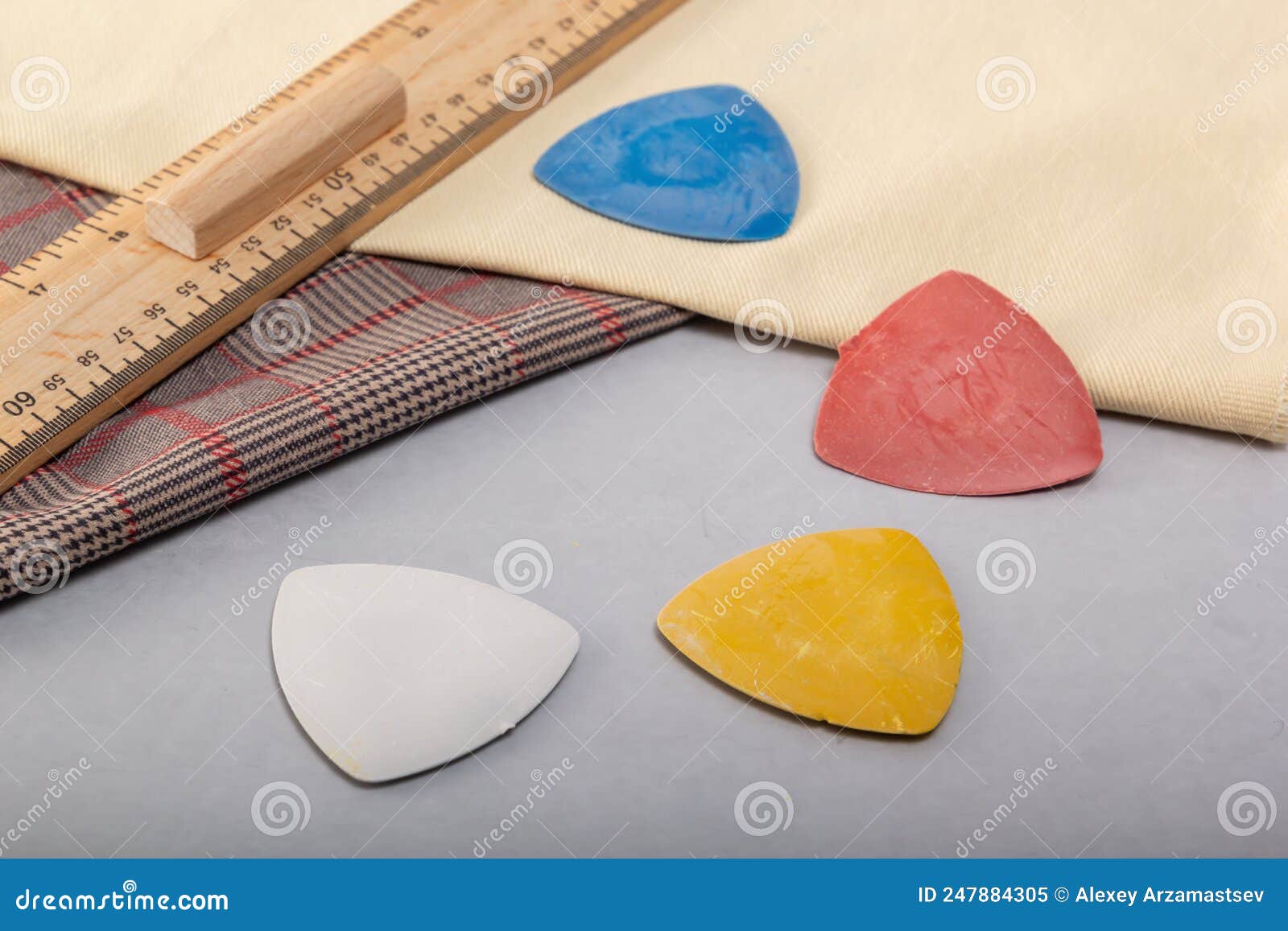 Multi-colored Tailor`s Crayons on the Background of Pieces of Fabric ...