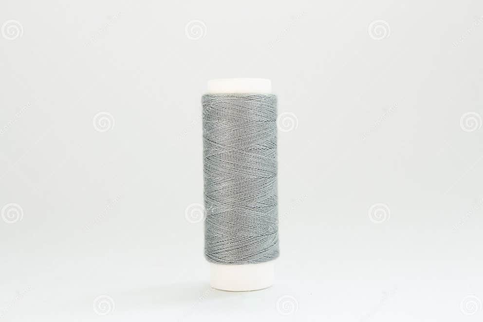 Grey Threads for Sewing on a White Background Stock Photo - Image of ...