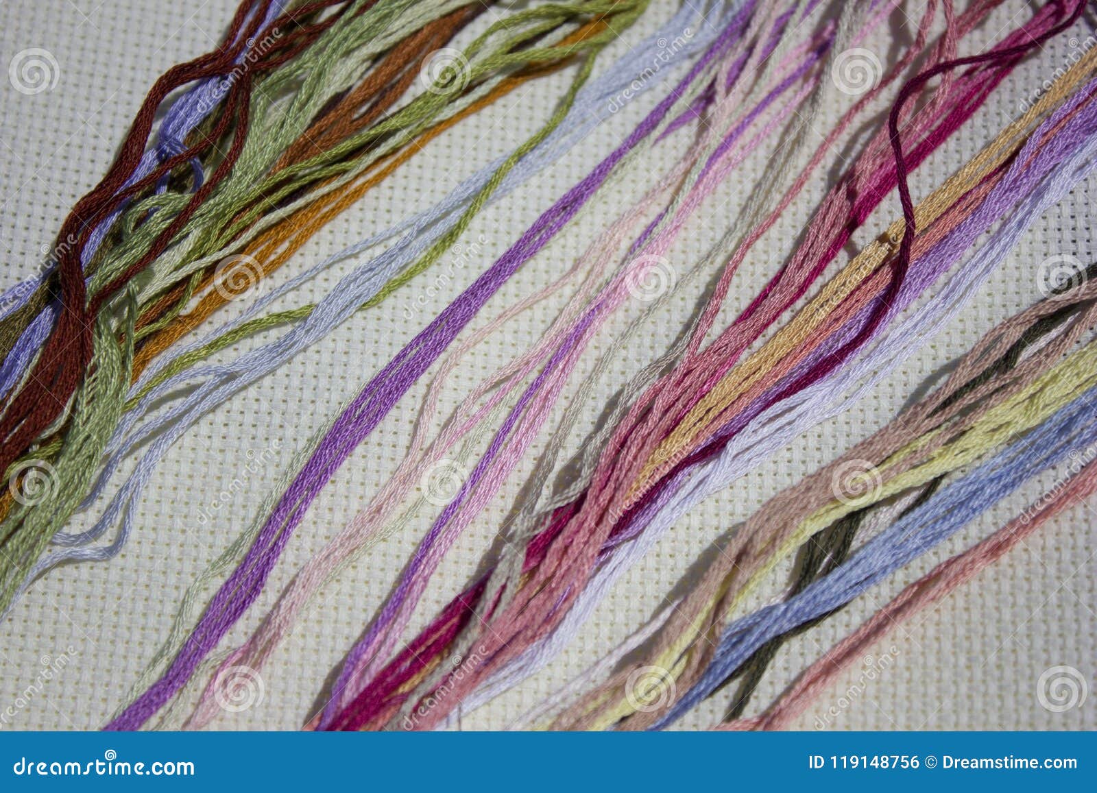 Multi-colored Threads on White Canvas Stock Photo - Image of settings ...