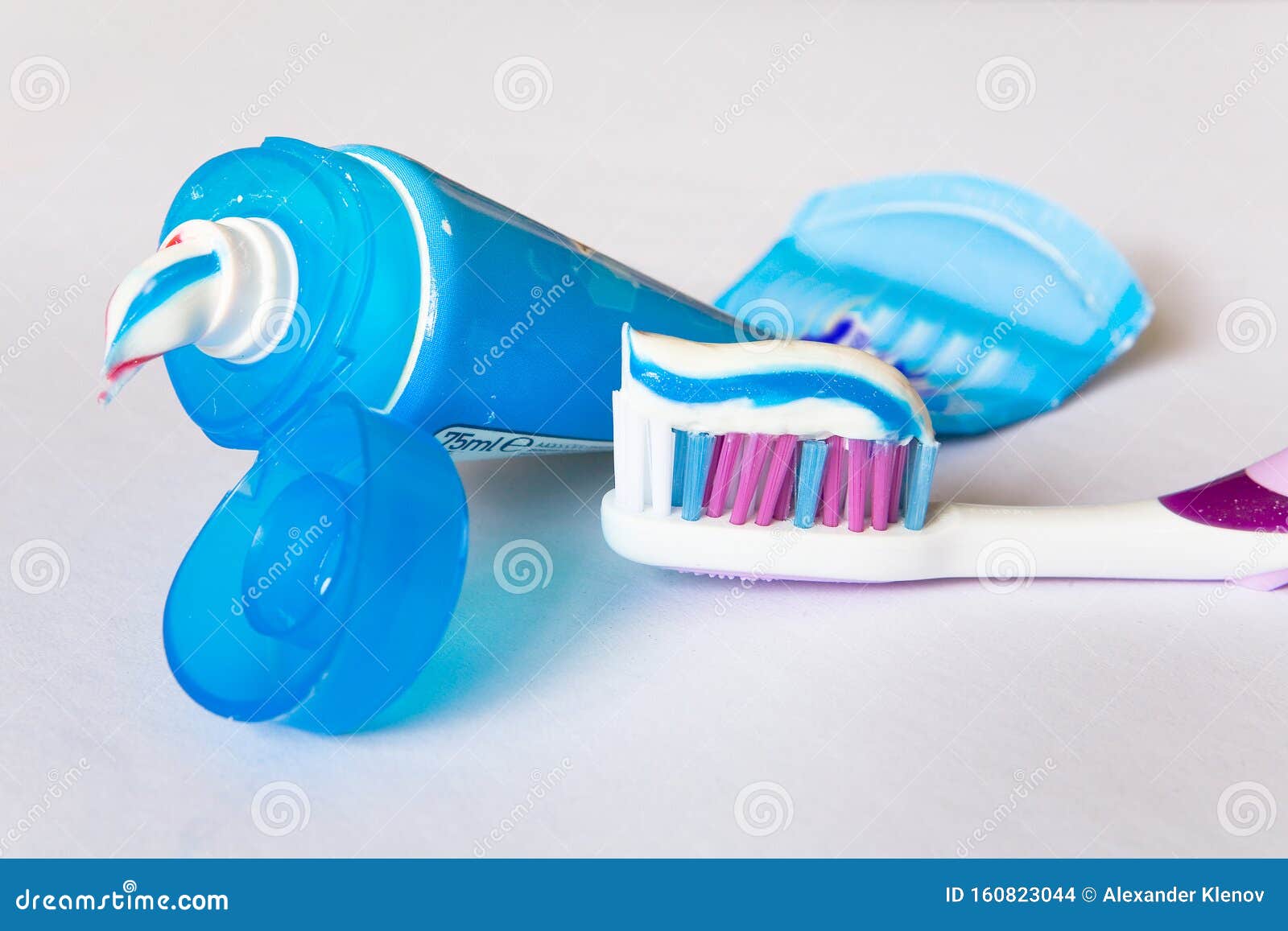 Multi-colored Toothpaste on a Toothbrush and Tube Stock Photo - Image ...