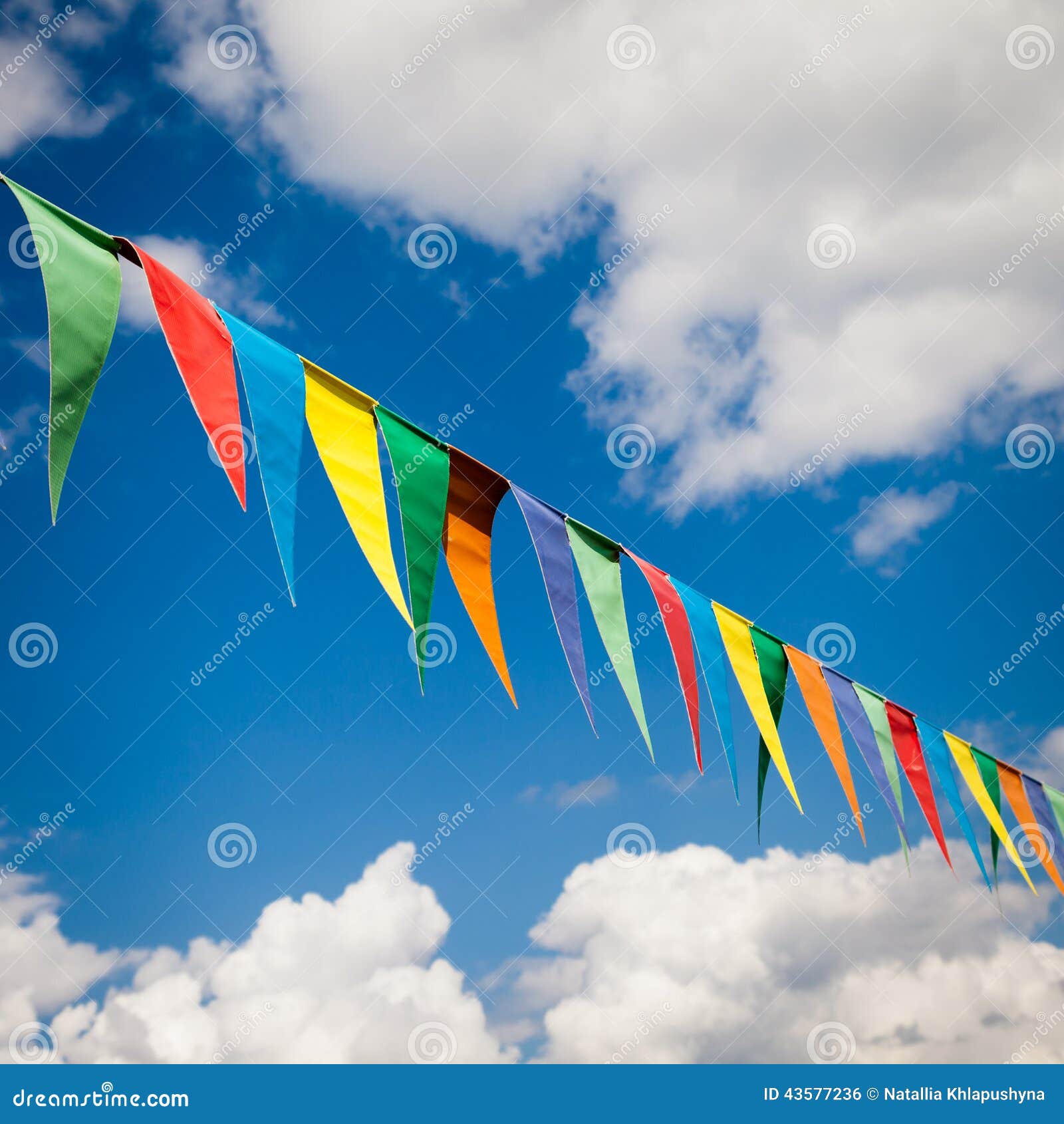Multi Colored Triangular Flags on Blue Sky Background Stock Photo ...