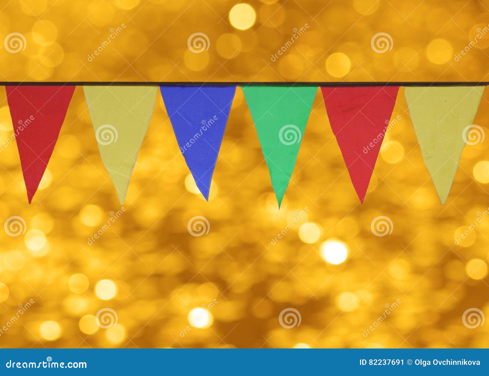 Multi Colored Triangular Flags Hanging Against the Backdrop of Gold ...