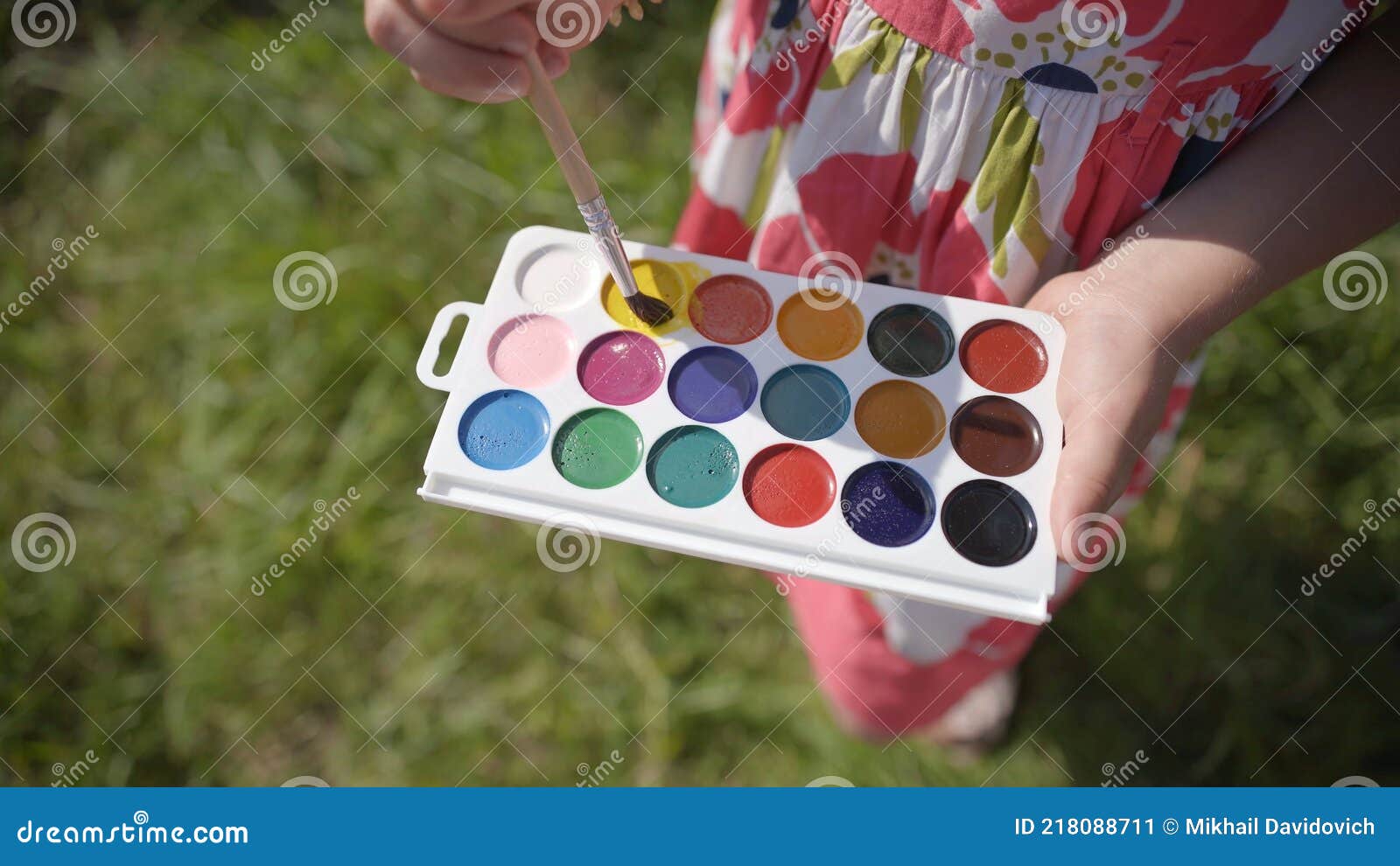 Multi-colored Watercolor Paints in the Hands of a Child. Stock Image ...