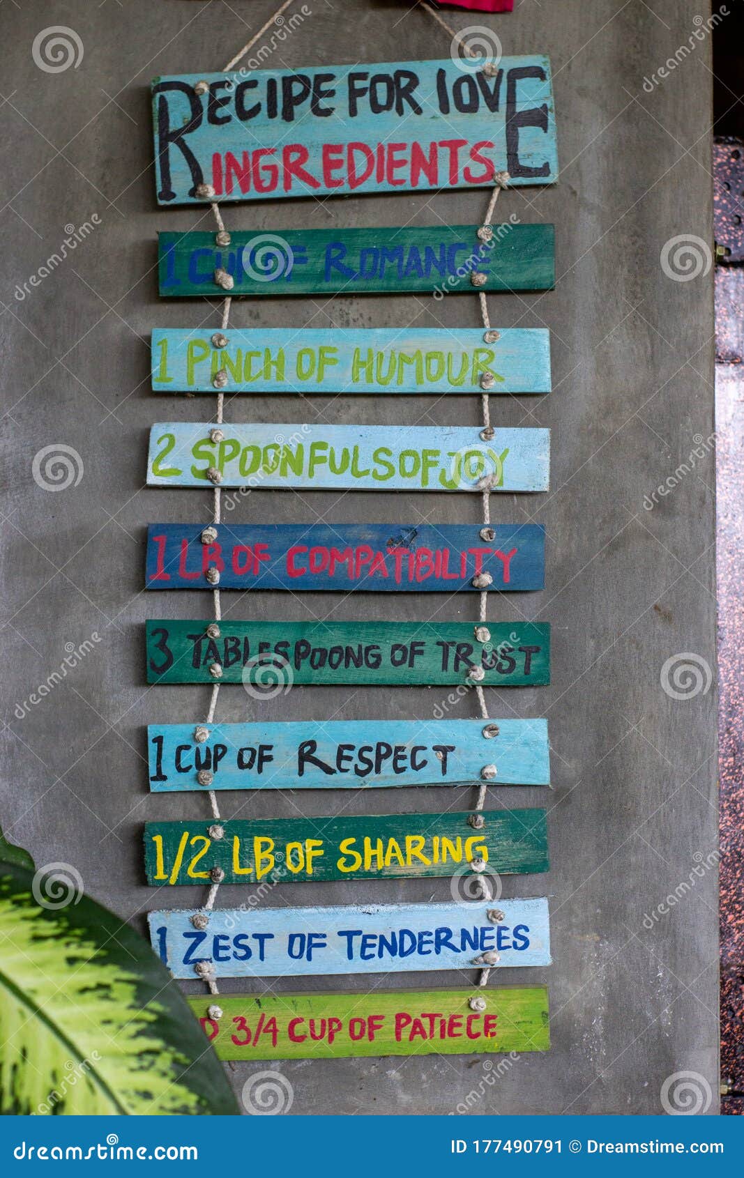 Multi-colored Wooden Sign on a Gray Wall Stock Image - Image of ...