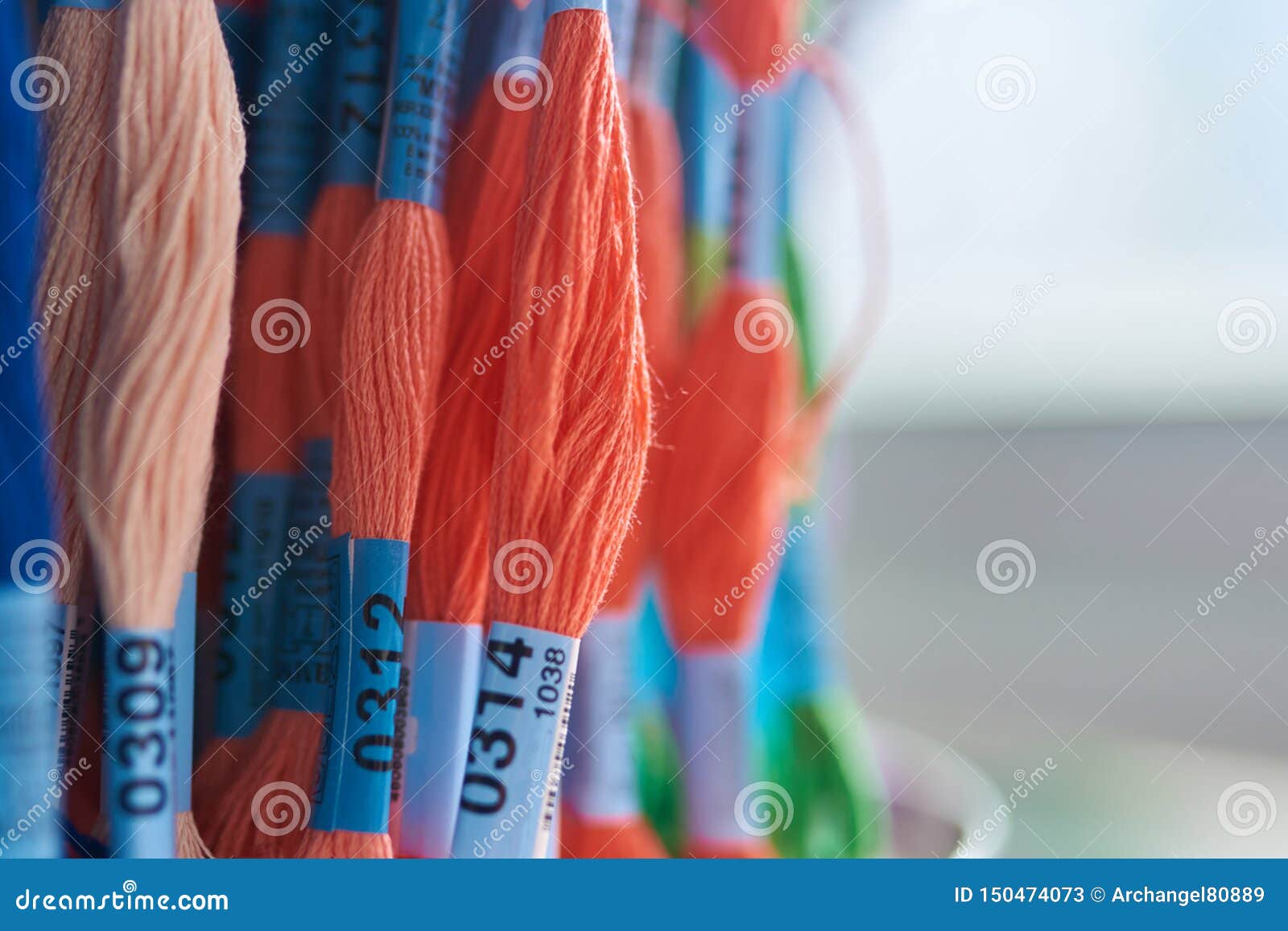Multi-colored Wool Thread Floss in Skeins on the Stand in the Store ...