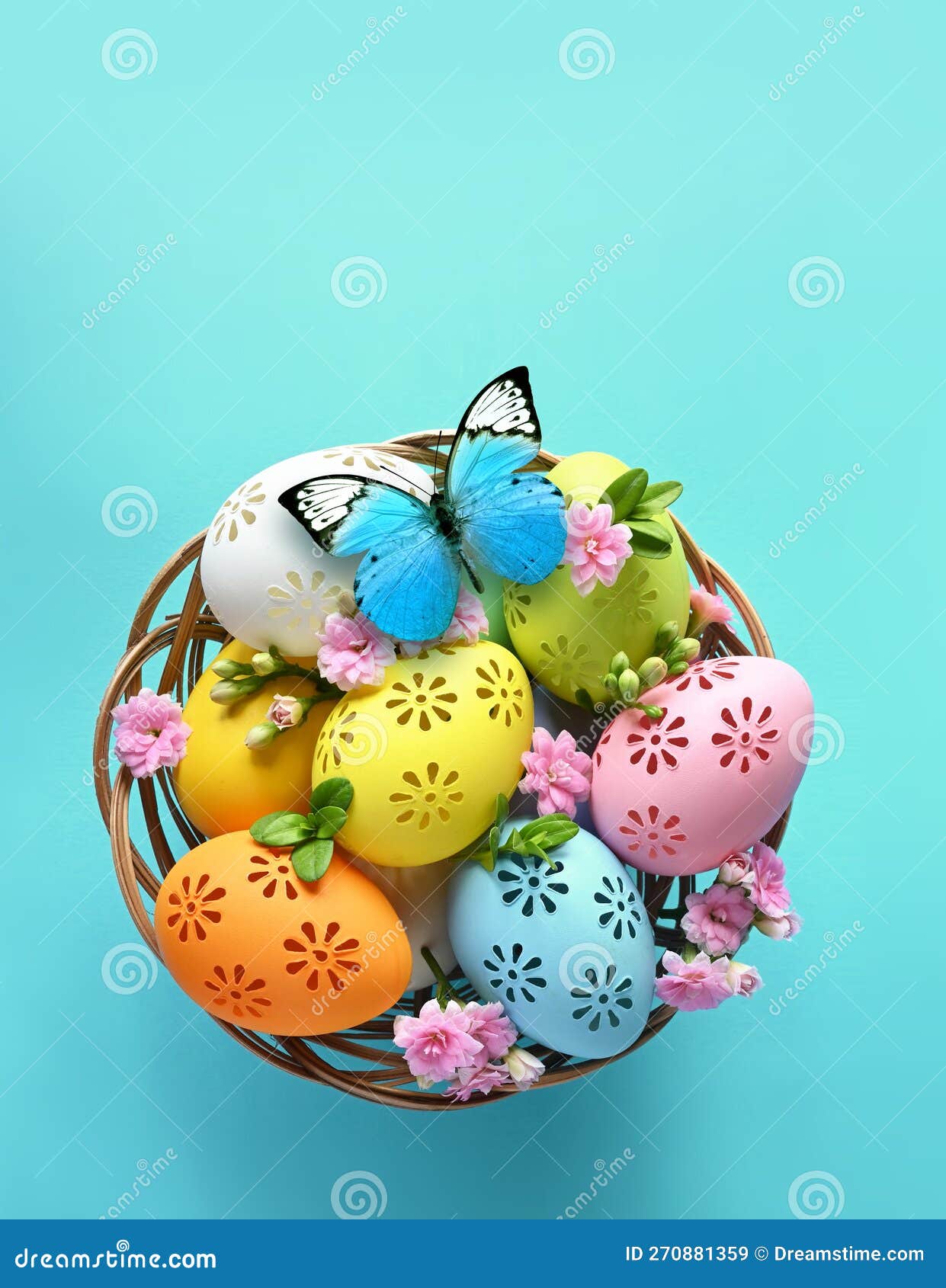 Multi Colors Easter Eggs in the Basket and Flowers on Blue Background ...