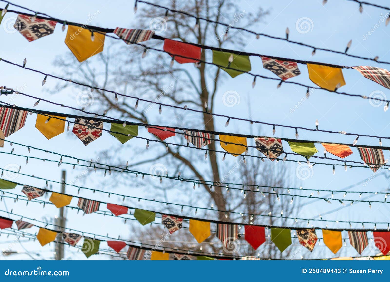 Multi Colour Cloth Flags on a Wire with Lights Stock Image - Image of ...