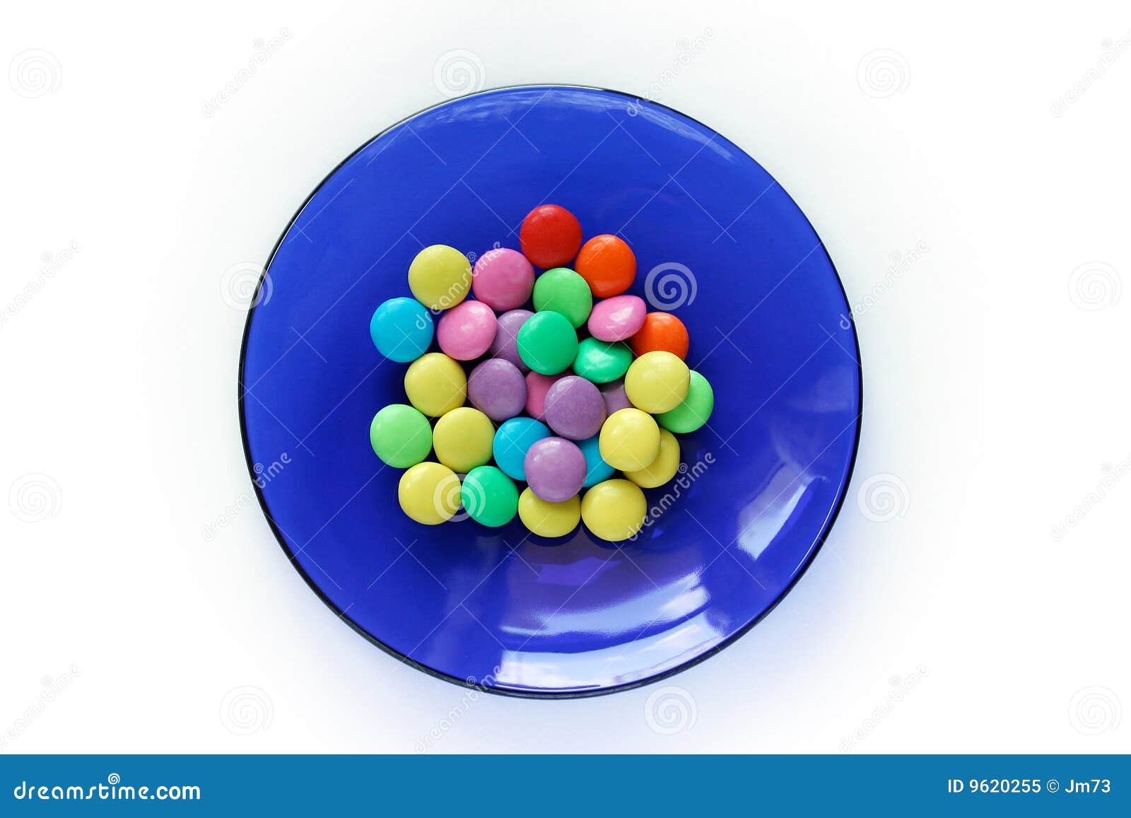 Multi-coloured Goodies on Blue Plate Stock Image - Image of greasiness ...