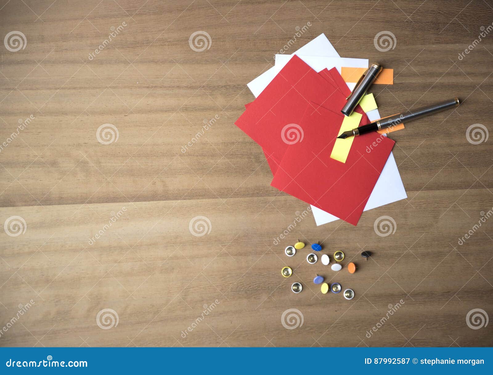 Multi Coloured Note Paper with Drawing Pins and a Pen Stock Image ...