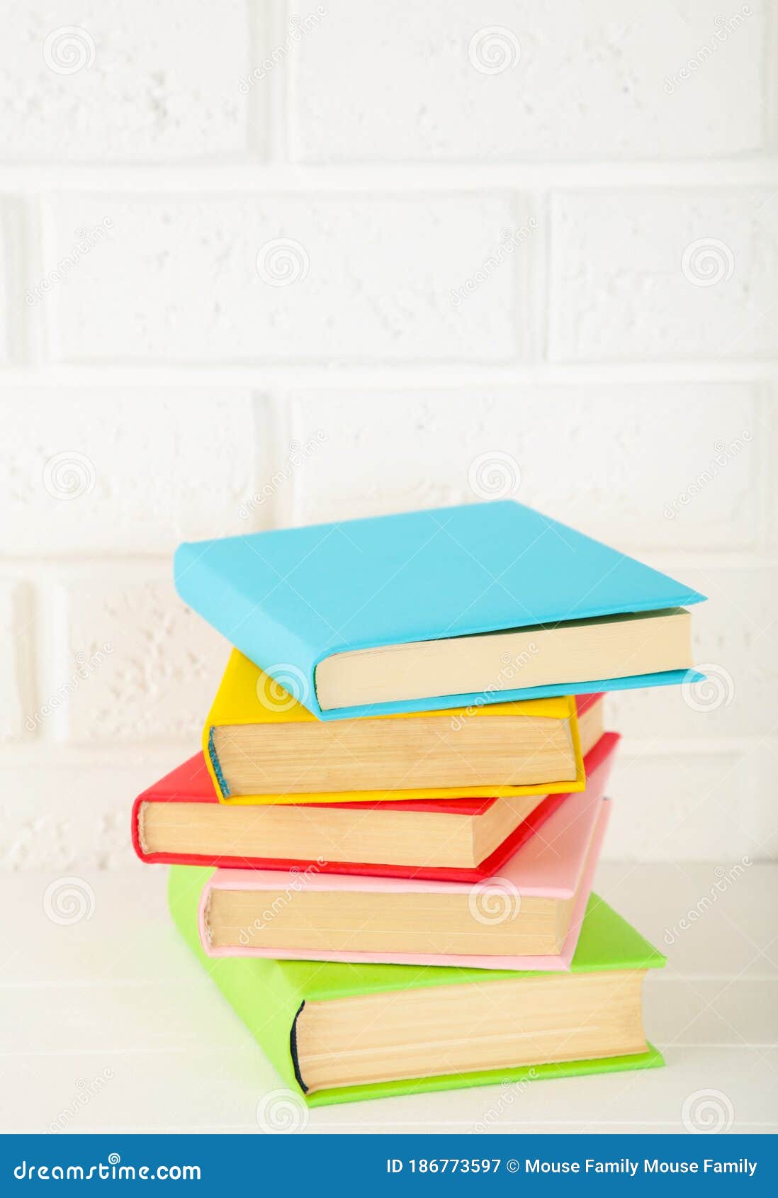 Multi Coloured School Books on a White Background with Copy Space Stock ...