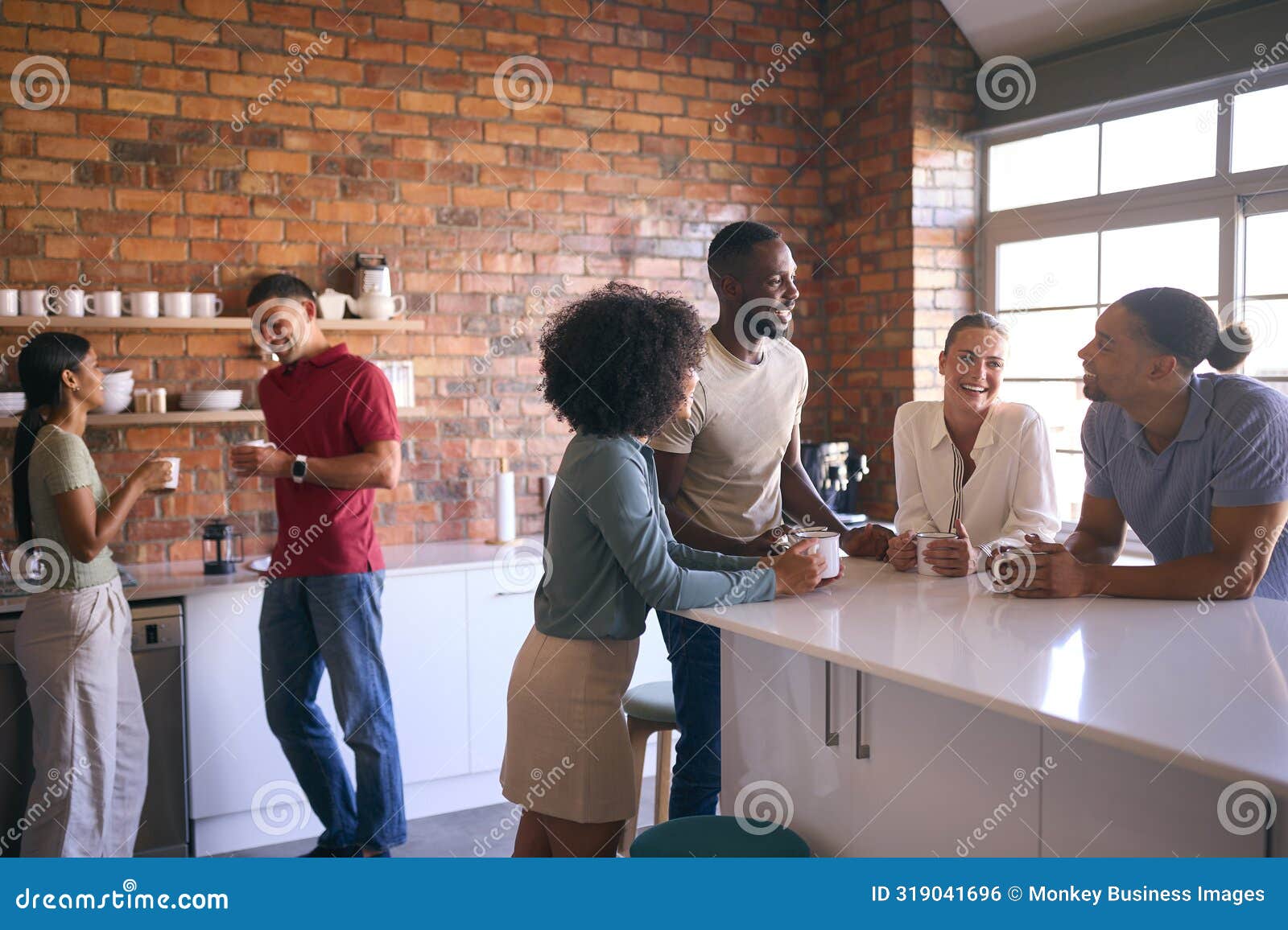 Multi-Cultural Business Team Taking Coffee Break in Kitchen Area of ...