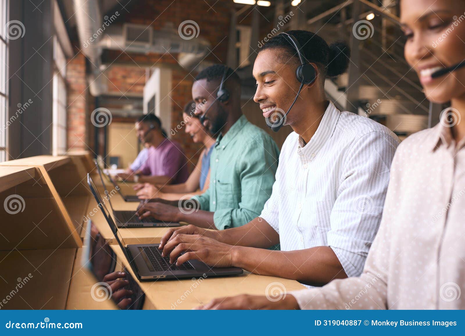 Multi-Cultural Customer Support or Telesales Team in Modern Open Plan ...