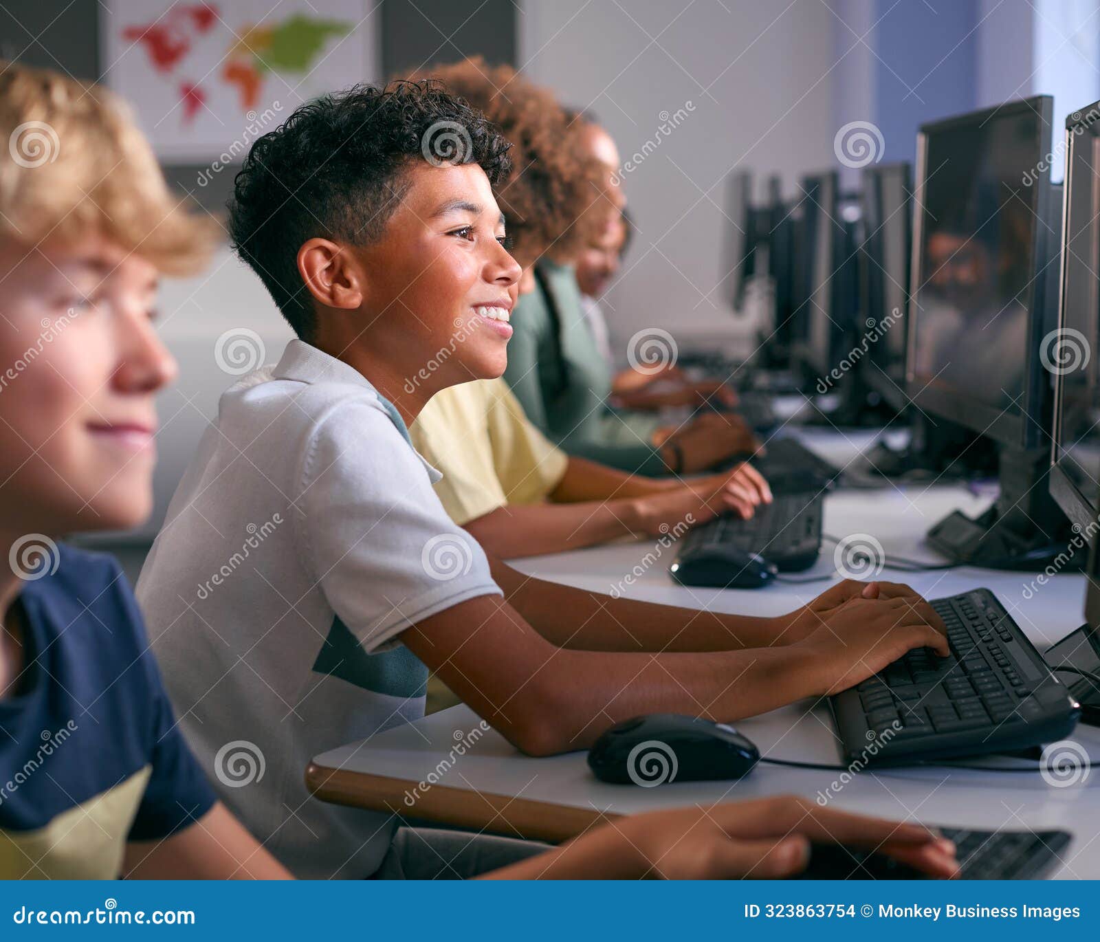 Multi-Cultural Group of Secondary or High School Students at Computers ...