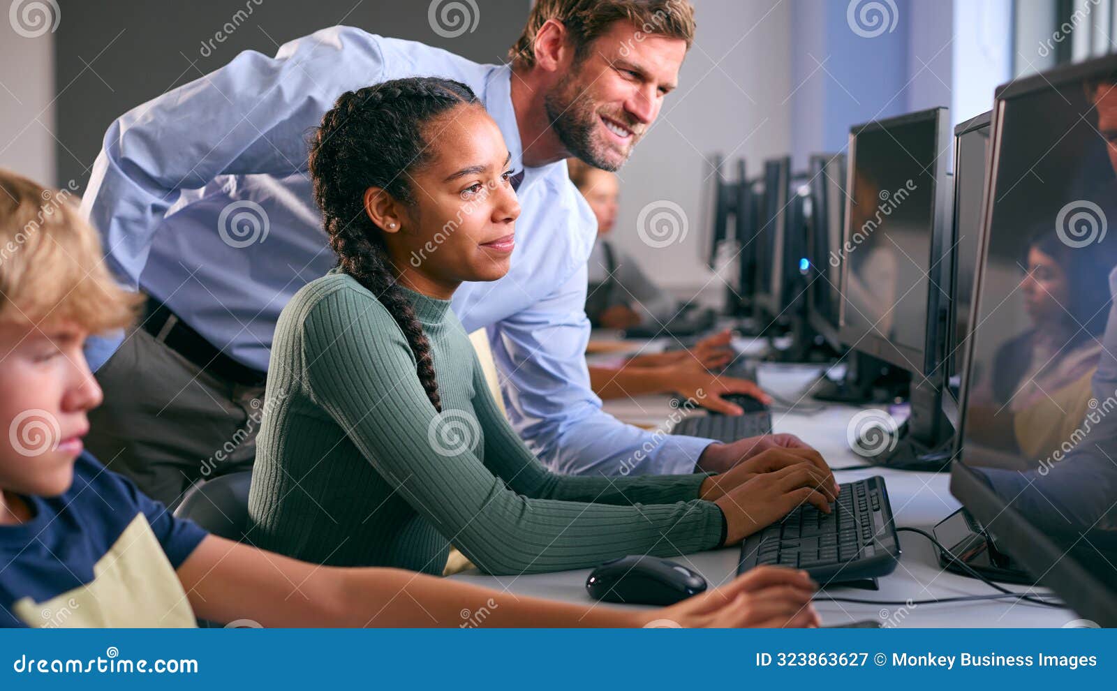 Multi-Cultural Group of Secondary or High School Students at Computers ...