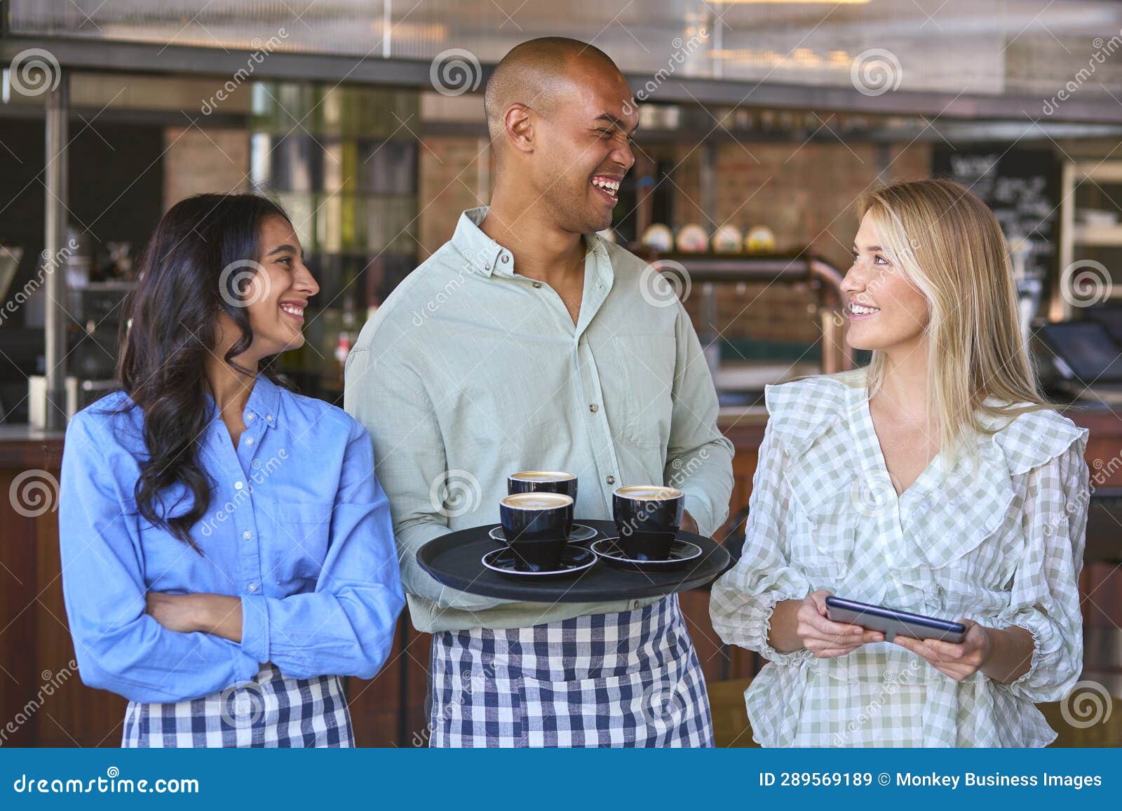 Multi-Cultural Staff Team with Digital Tablet Working in Restaurant or ...