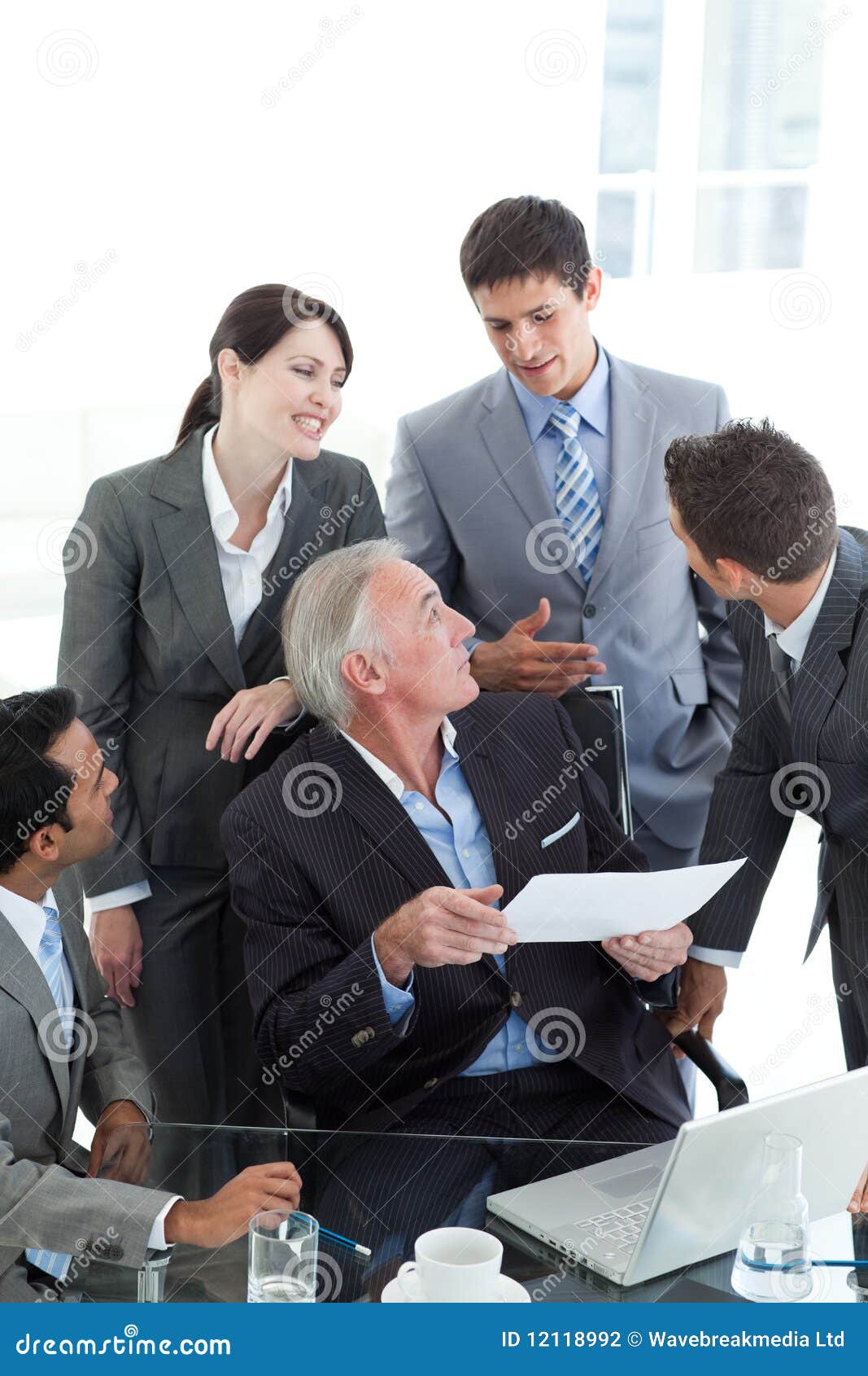 Multi-ethnic Business People Discussing a Contract Stock Photo - Image ...