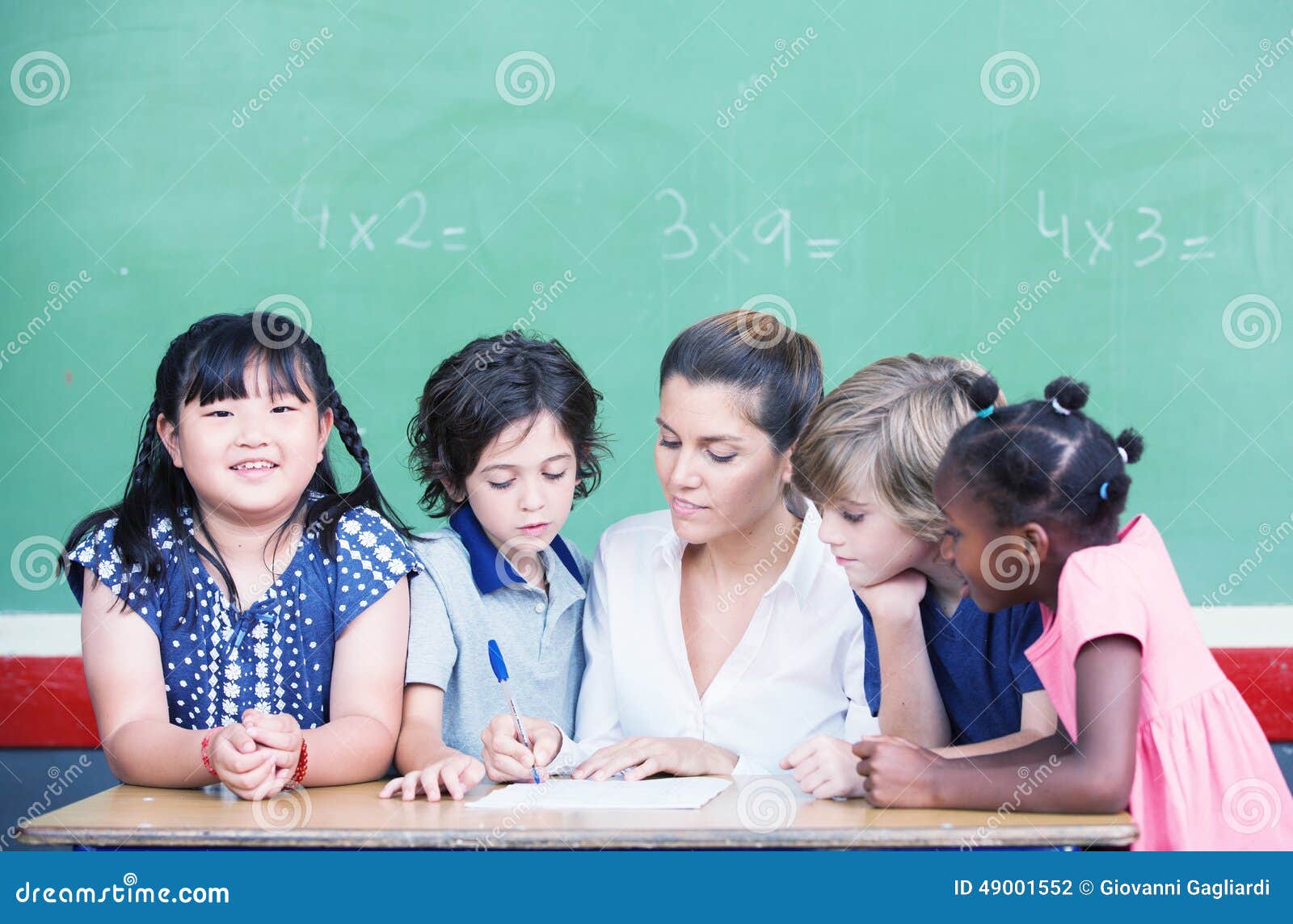 Multi Ethnic Classroom with Teacher Explaining Mathematics Lesson Stock ...