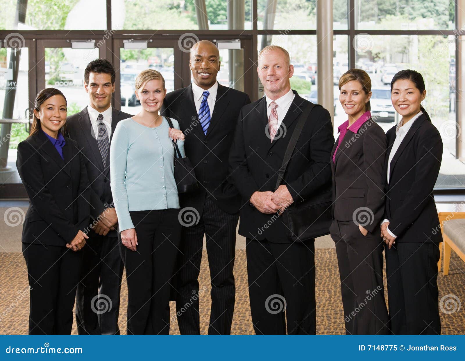 Multi-ethnic Co-workers Posing in Lobby Stock Image - Image of latin ...