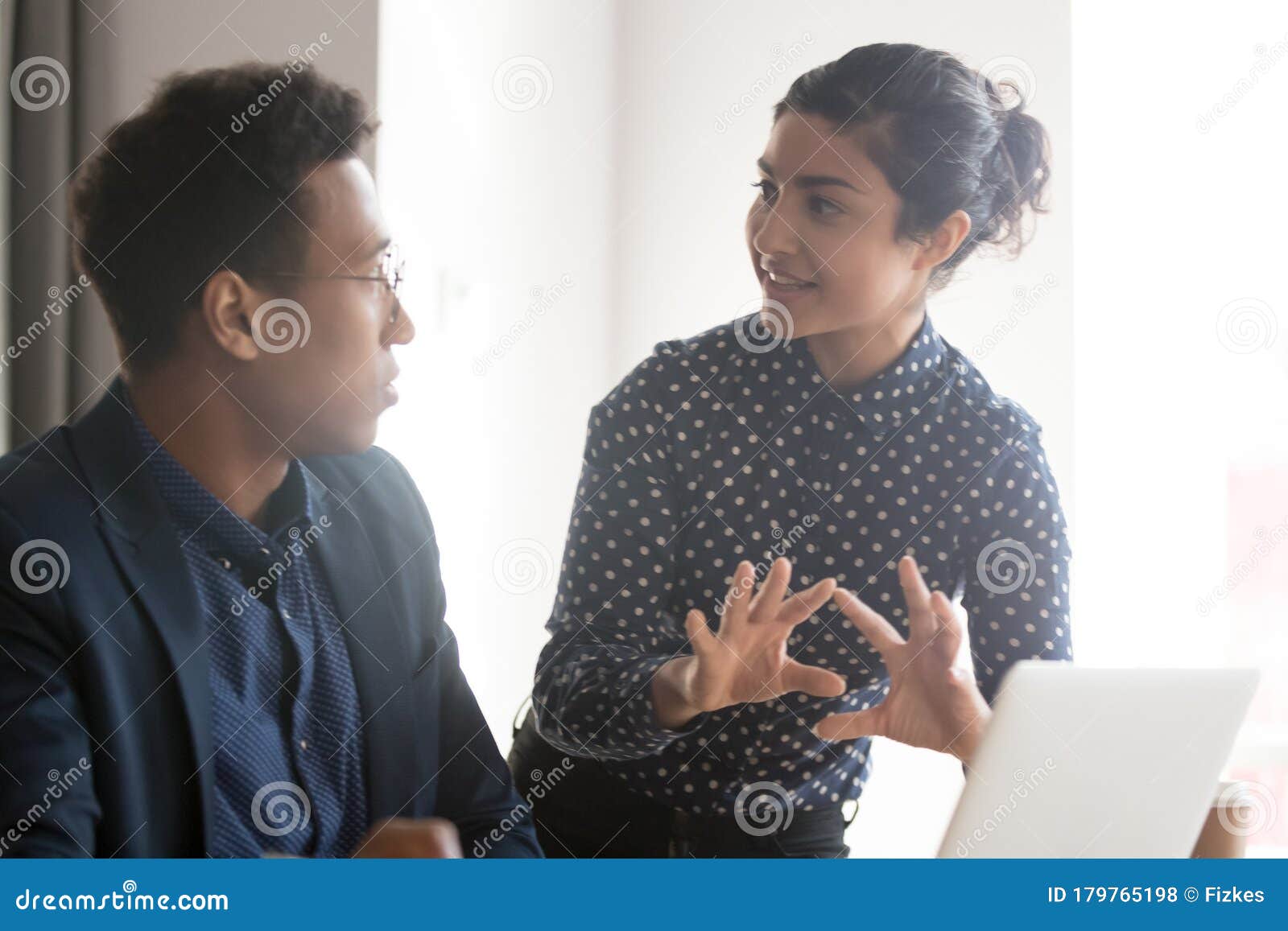 Multi-ethnic Colleagues Discuss Work-related Issues in Workplace Stock ...