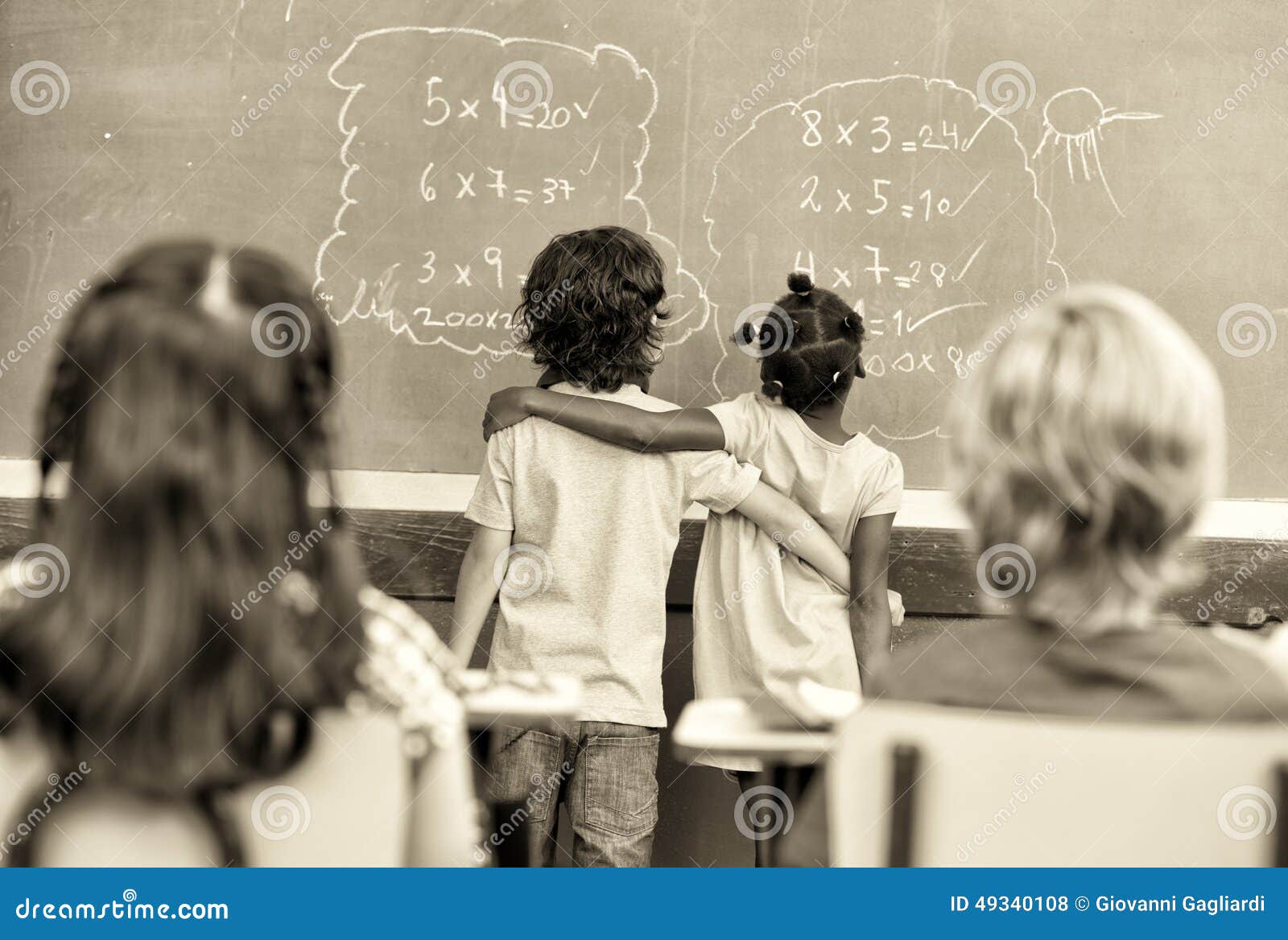 Multi Ethnic Elementary Students Embraced Learning Math at Chalk Stock ...