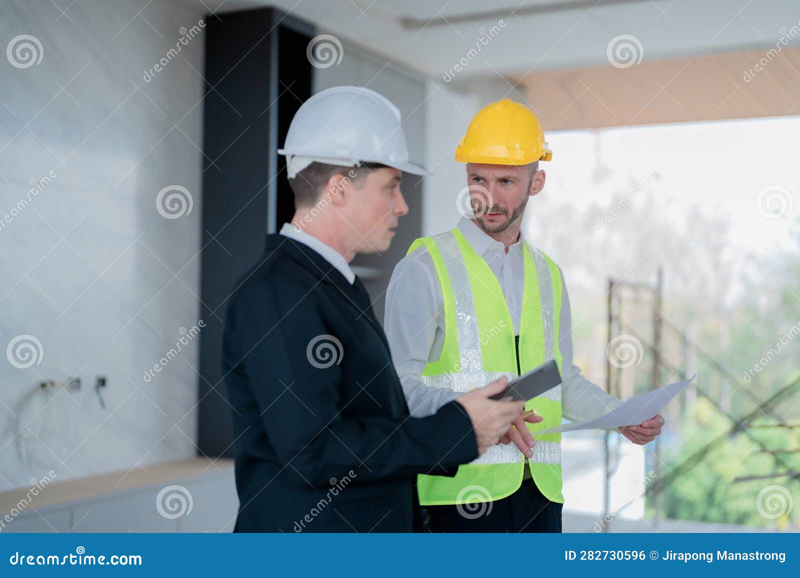 Multi Ethnic Engineer Brainstorming And Measuring For Cost Estimating ...