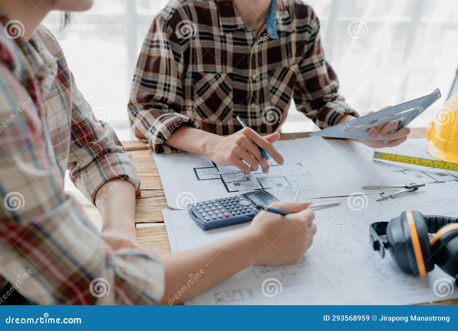 Multi Ethnic Engineer Brainstorming and Measuring for Cost Estimating ...