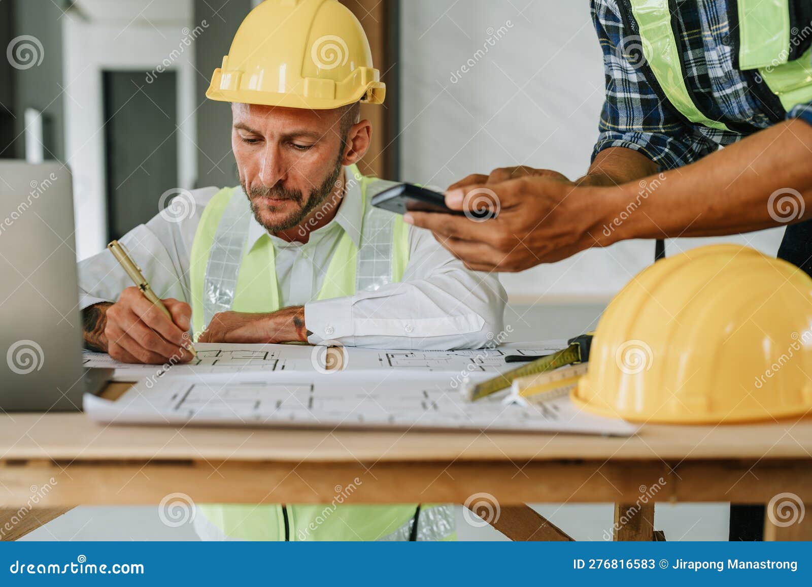 Multi Ethnic Engineer Brainstorming and Measuring for Cost Estimating ...