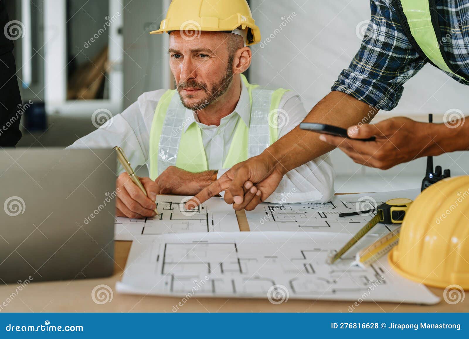 Multi Ethnic Engineer Brainstorming and Measuring for Cost Estimating ...