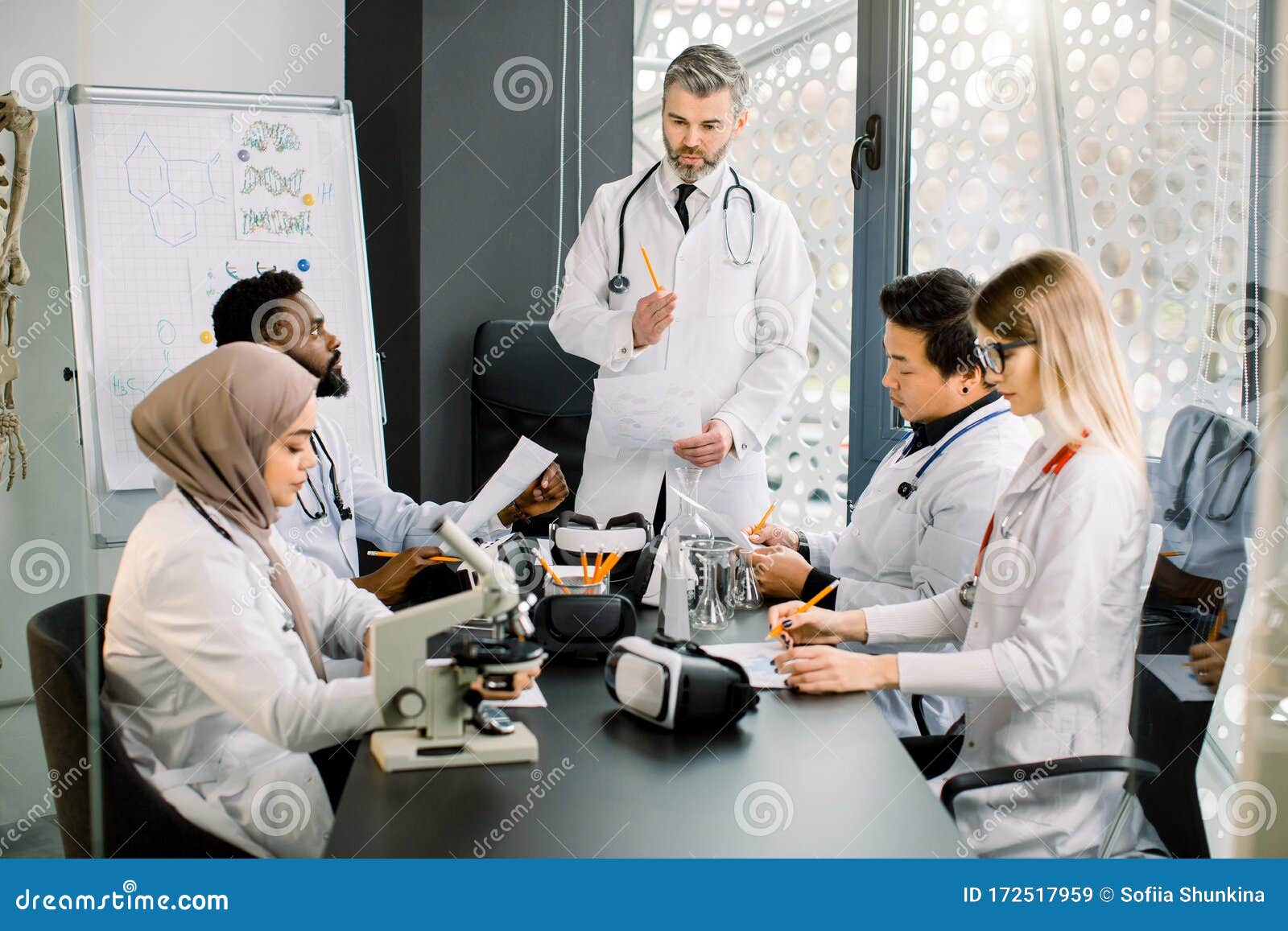 Professor Having Discussion With College Students Stock Photography ...