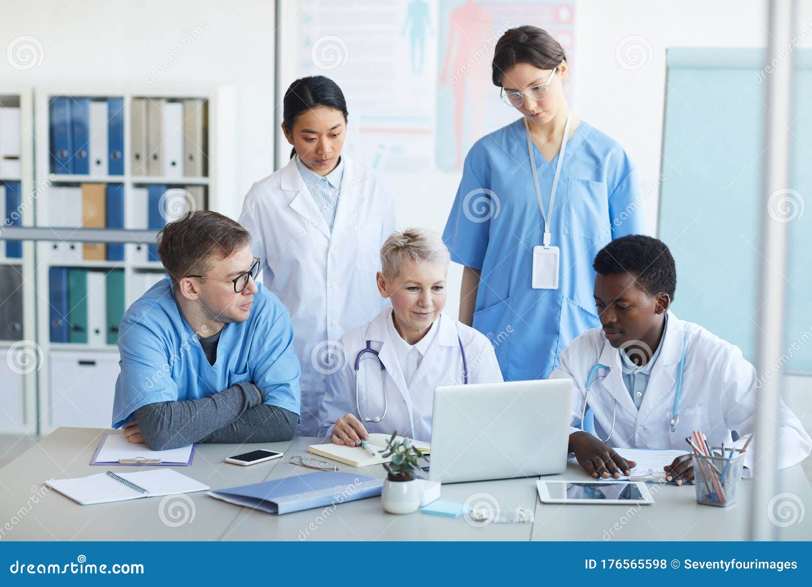 Multi-Ethnic Group of Doctors Working Together Stock Photo - Image of ...