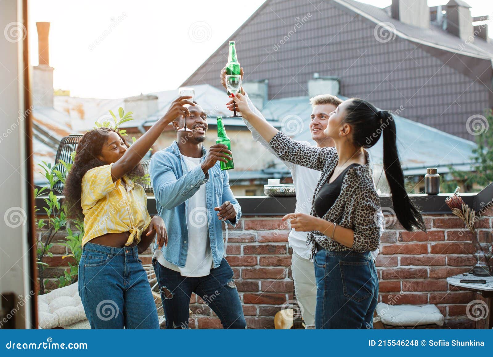 Multi Ethnic Group of Friends Dancing on Rooftop Stock Photo - Image of ...