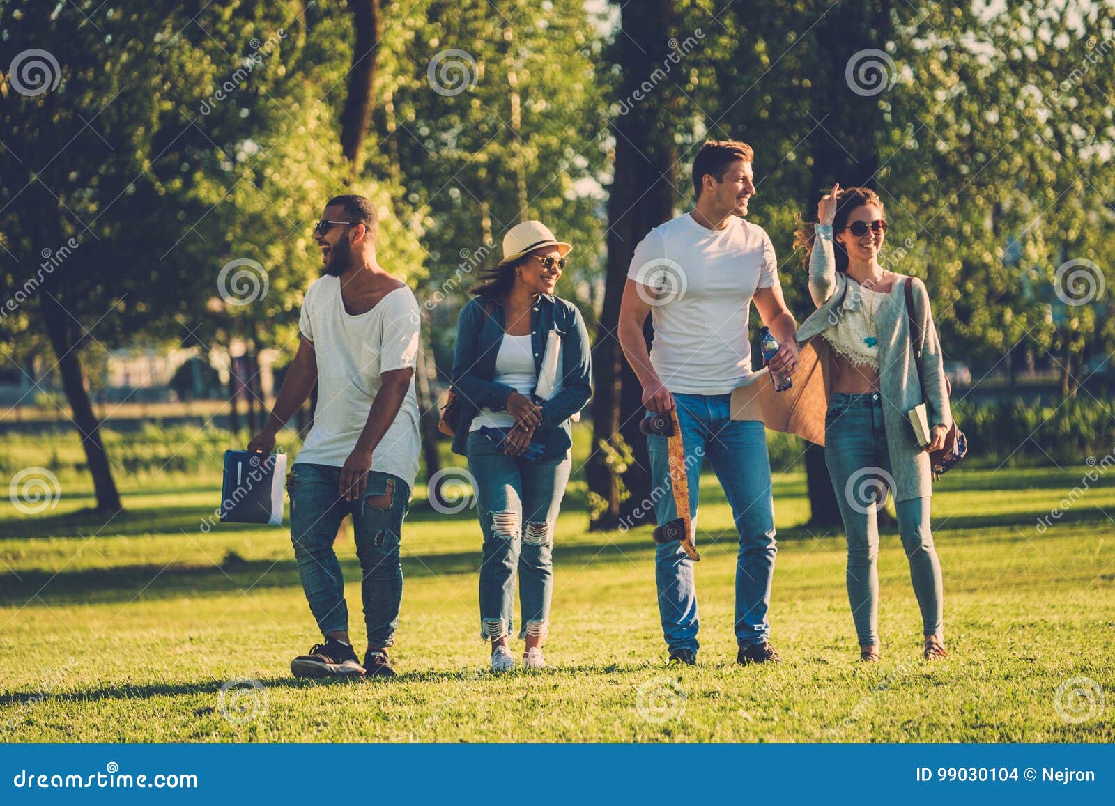 Multi-ethnic Group of Friends in a Park Stock Photo - Image of ...
