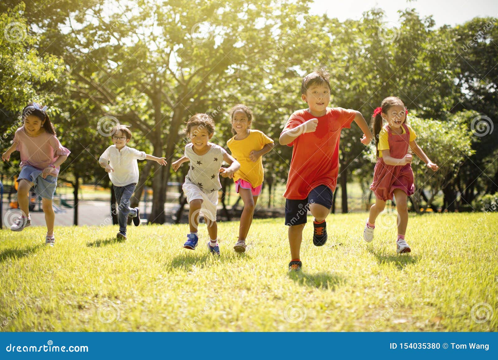 Multiethnic Group of School Children Laughing and Running Stock Photo ...