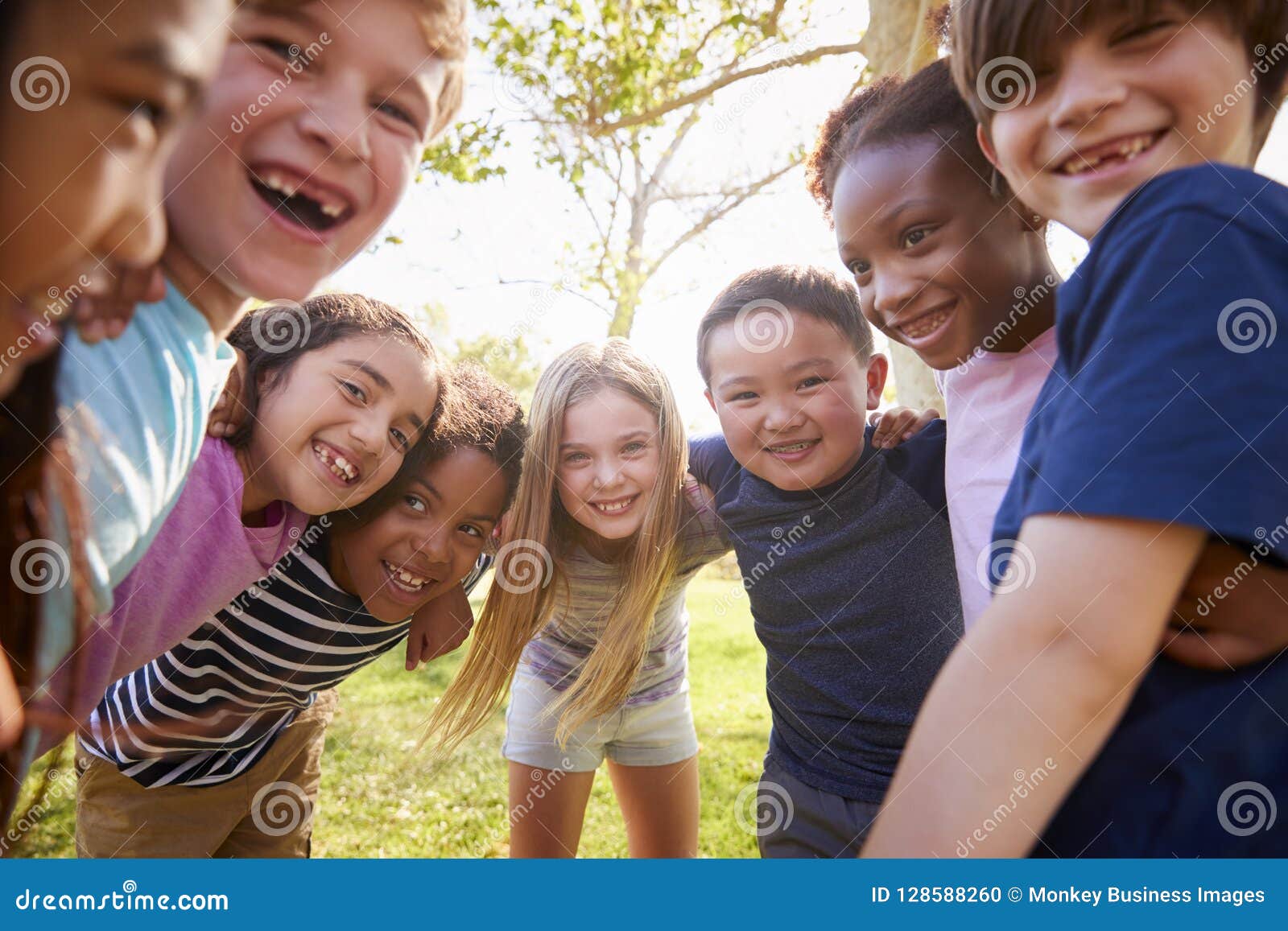 Multi-ethnic Group of Schoolchildren Laughing and Embracing Stock Photo ... Multi-ethnic Group of Schoolchildren Laughing and Embracing Stock Photo ...