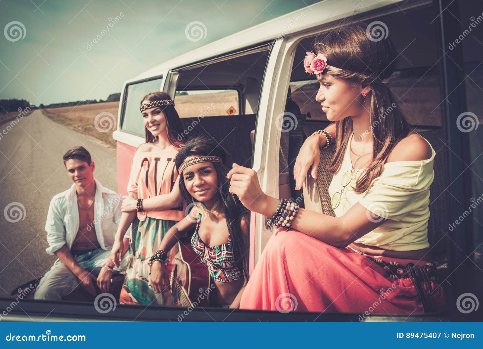 Multi-ethnic Hippie Friends with Guitar on a Road Trip Stock Image ...