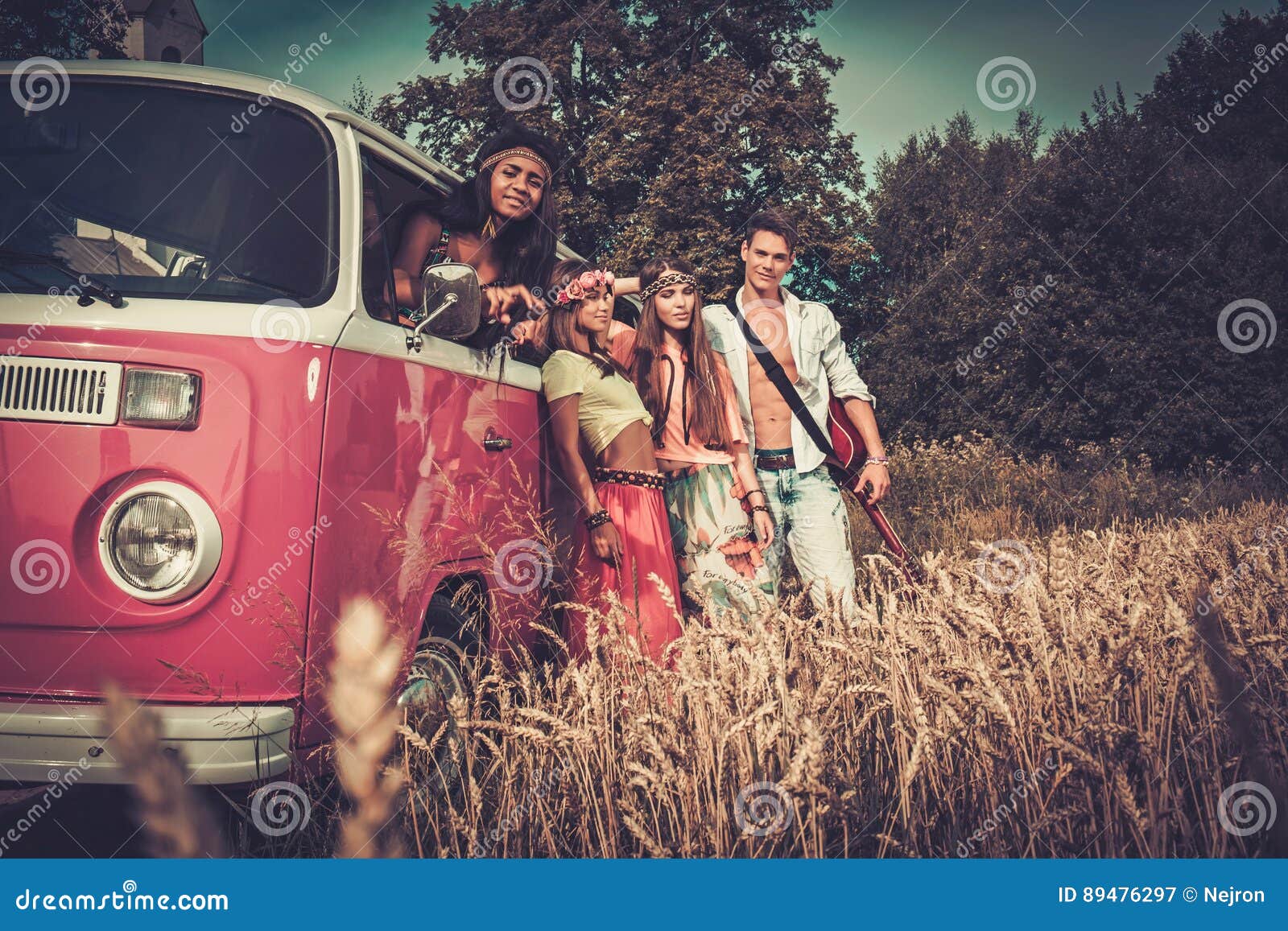 Multi-ethnic Hippie Friends with Guitar on a Road Trip Stock Image ...