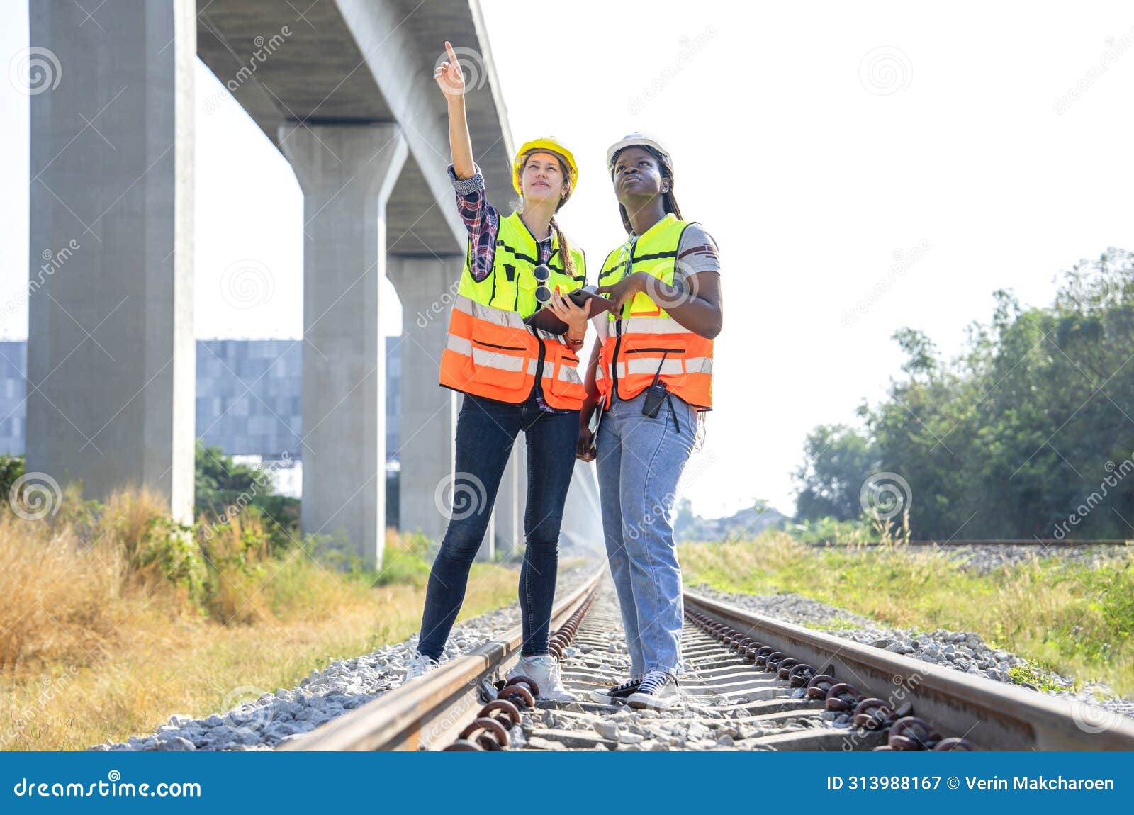 Multi Ethnic Railway Construction Workers Working Outdoors,standing at ...