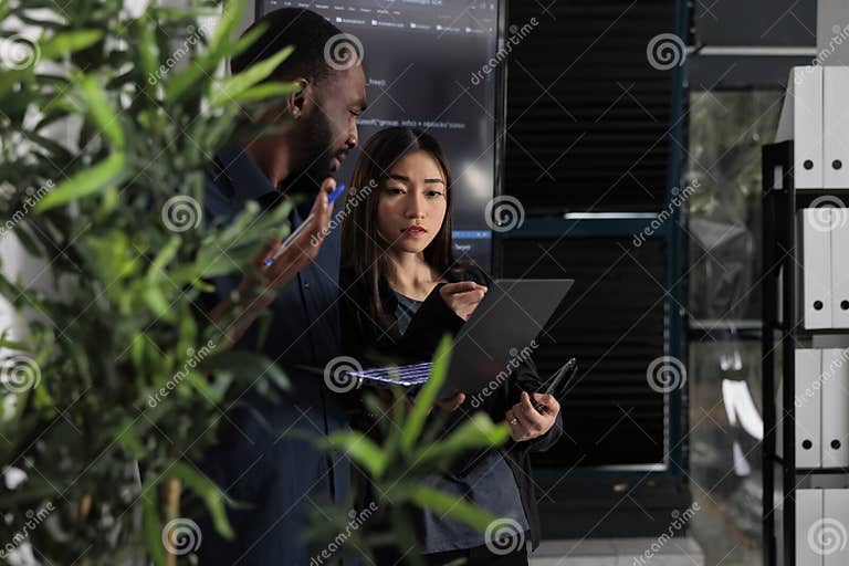 Multi Ethnic Team of System Developers Analyzing Html Code Stock Photo ... Multi Ethnic Team of System Developers Analyzing Html Code Stock Photo ...