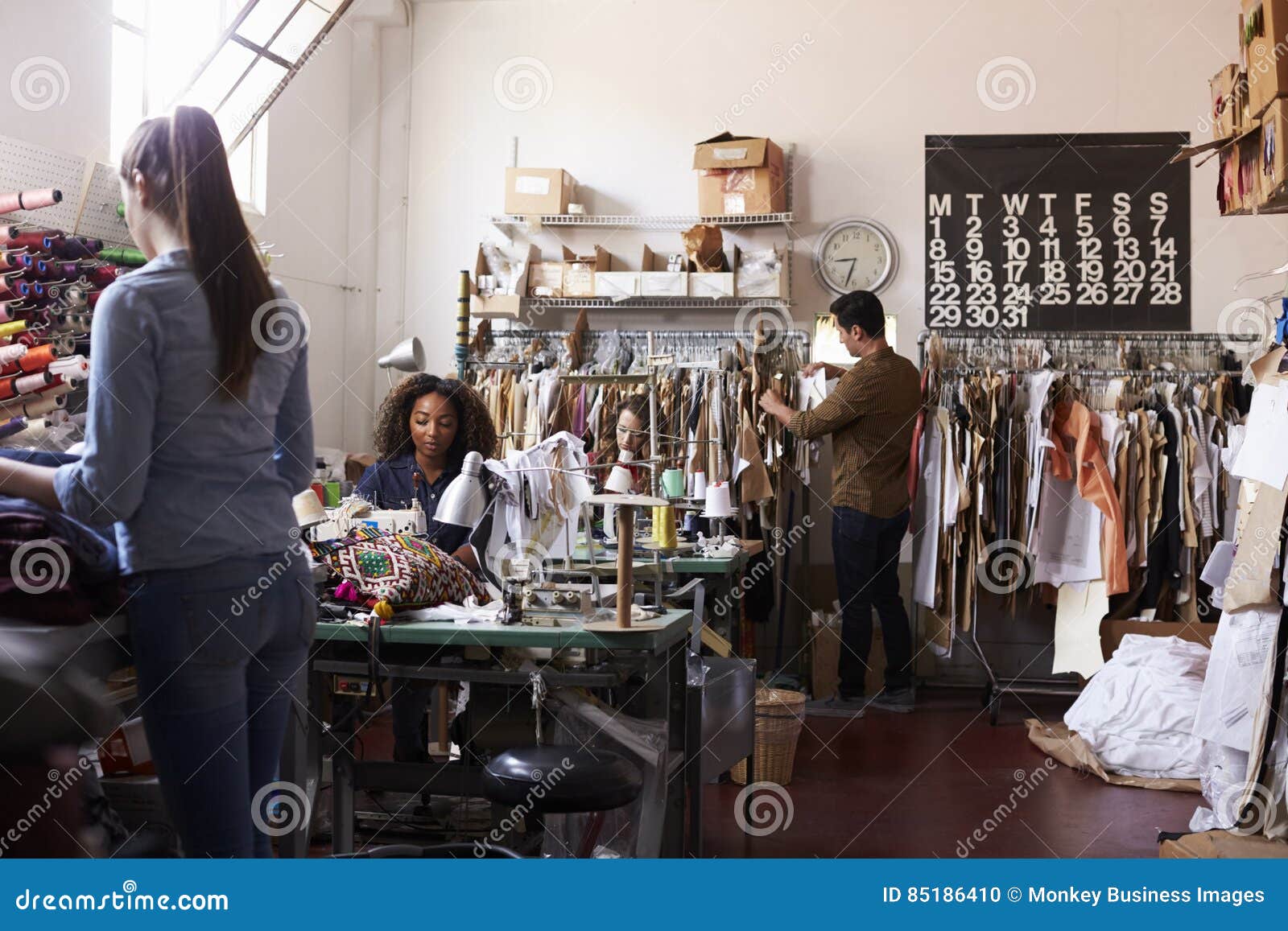 Multi Ethnic Team Working Together in Clothes Design Studio Stock Photo ...