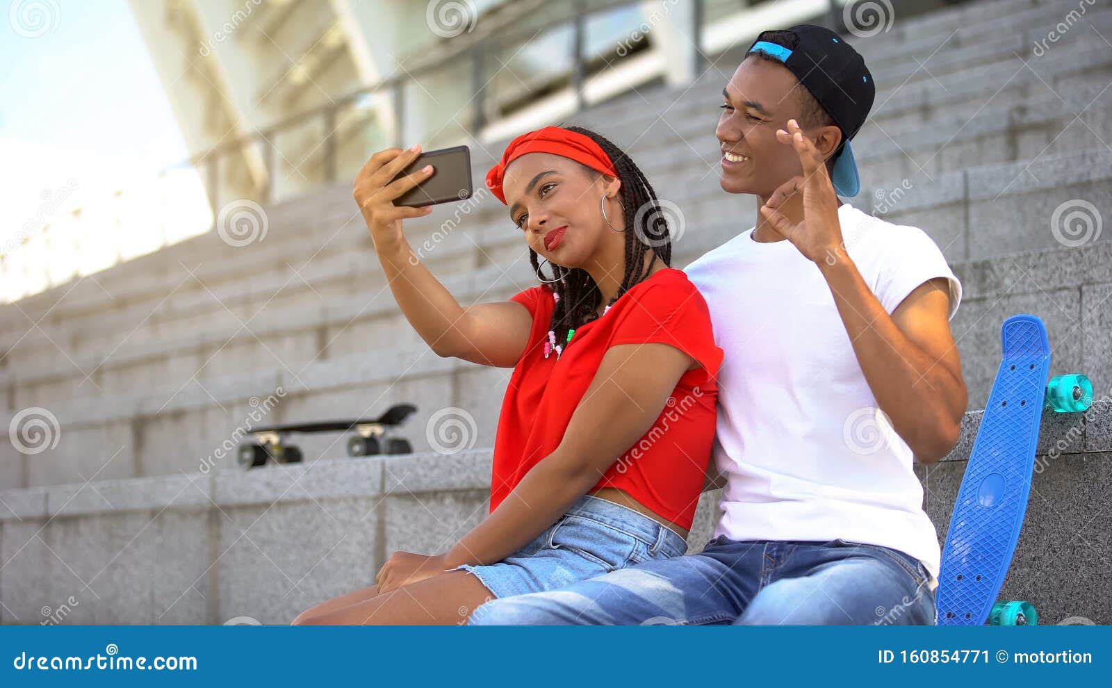 Multi-ethnic Teenagers Making Selfie and Having Fun Sitting on Stairs ... Multi-ethnic Teenagers Making Selfie and Having Fun Sitting on Stairs ...